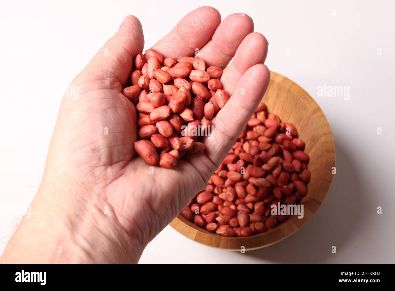 Hand full of nuts hi-res stock photography and images - Alamy