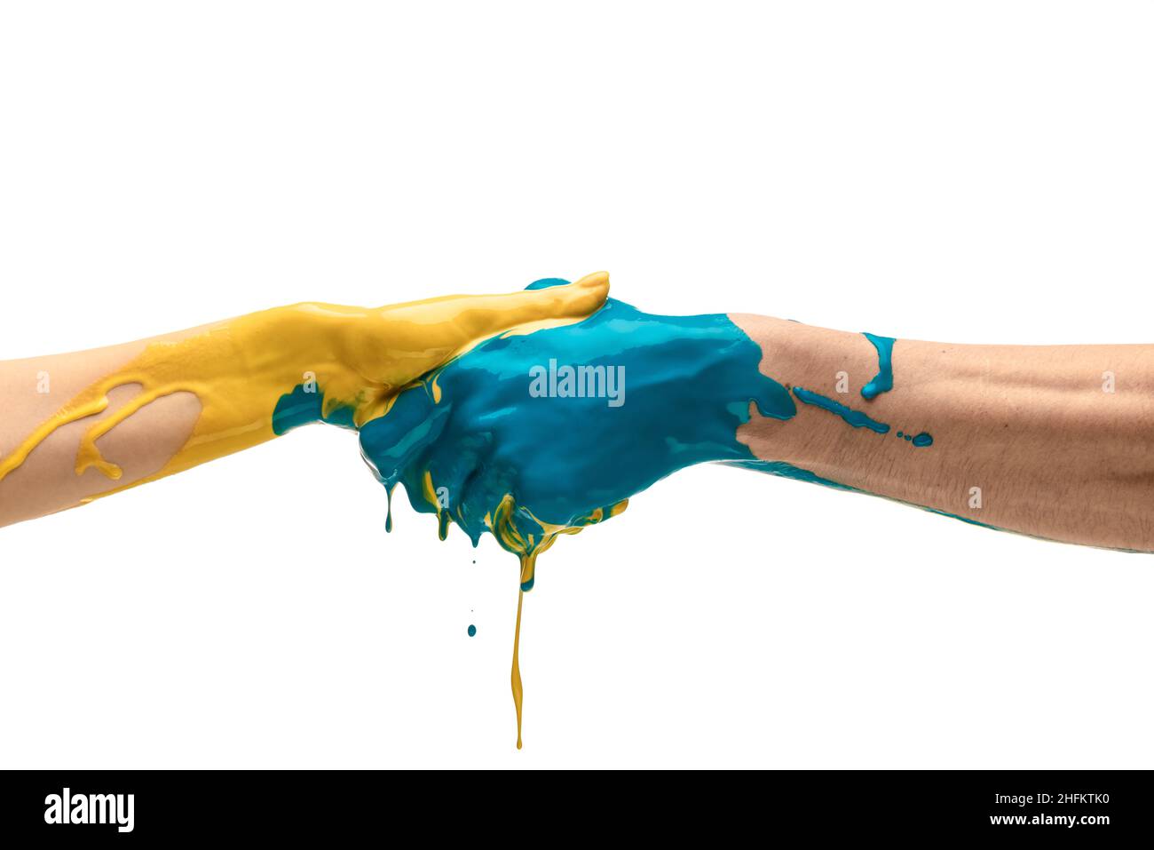 Two painted human hands handshaking isolated on white studio background ...