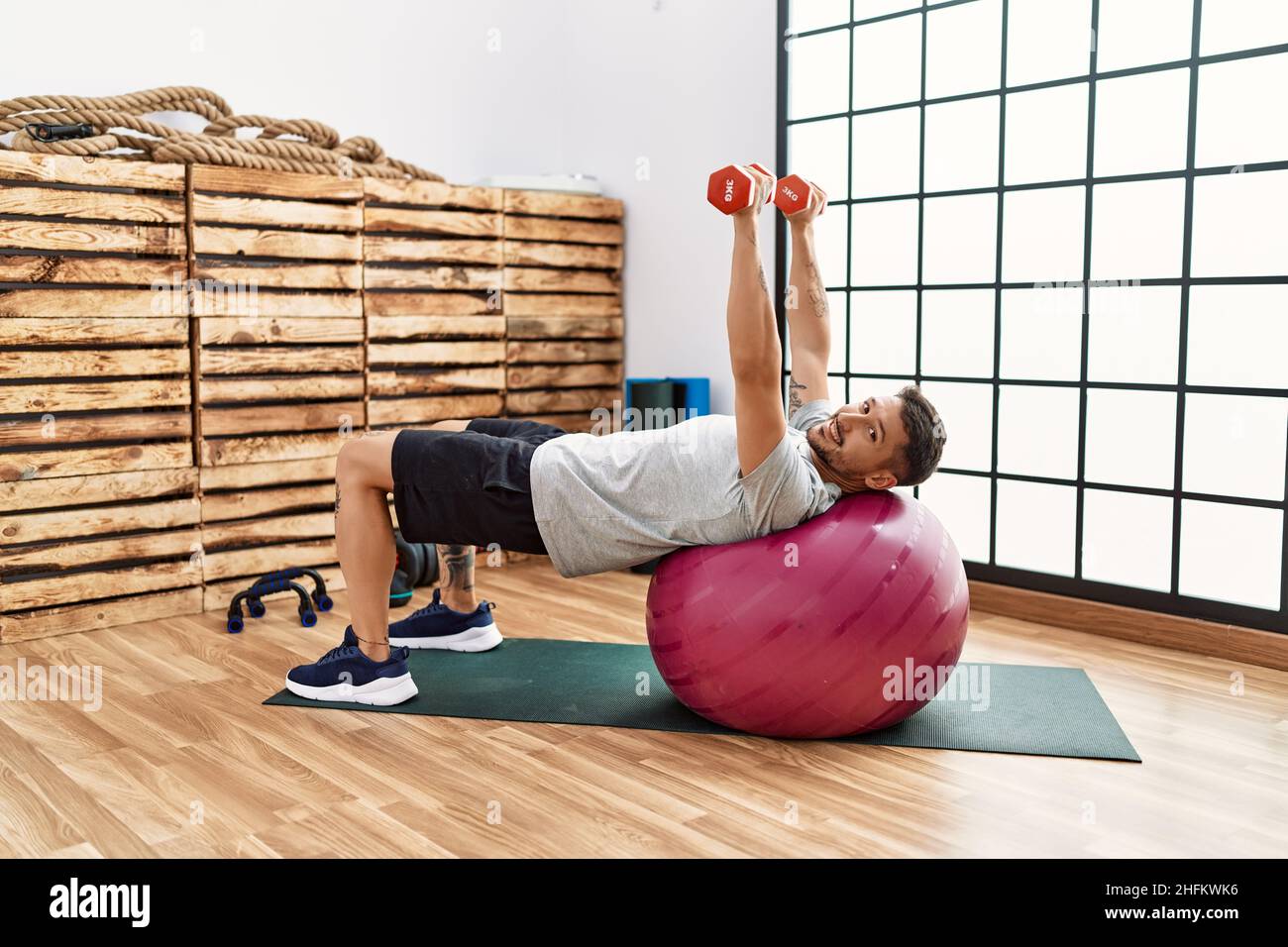 Young hispanic man smiling confident training at sport center Stock ...