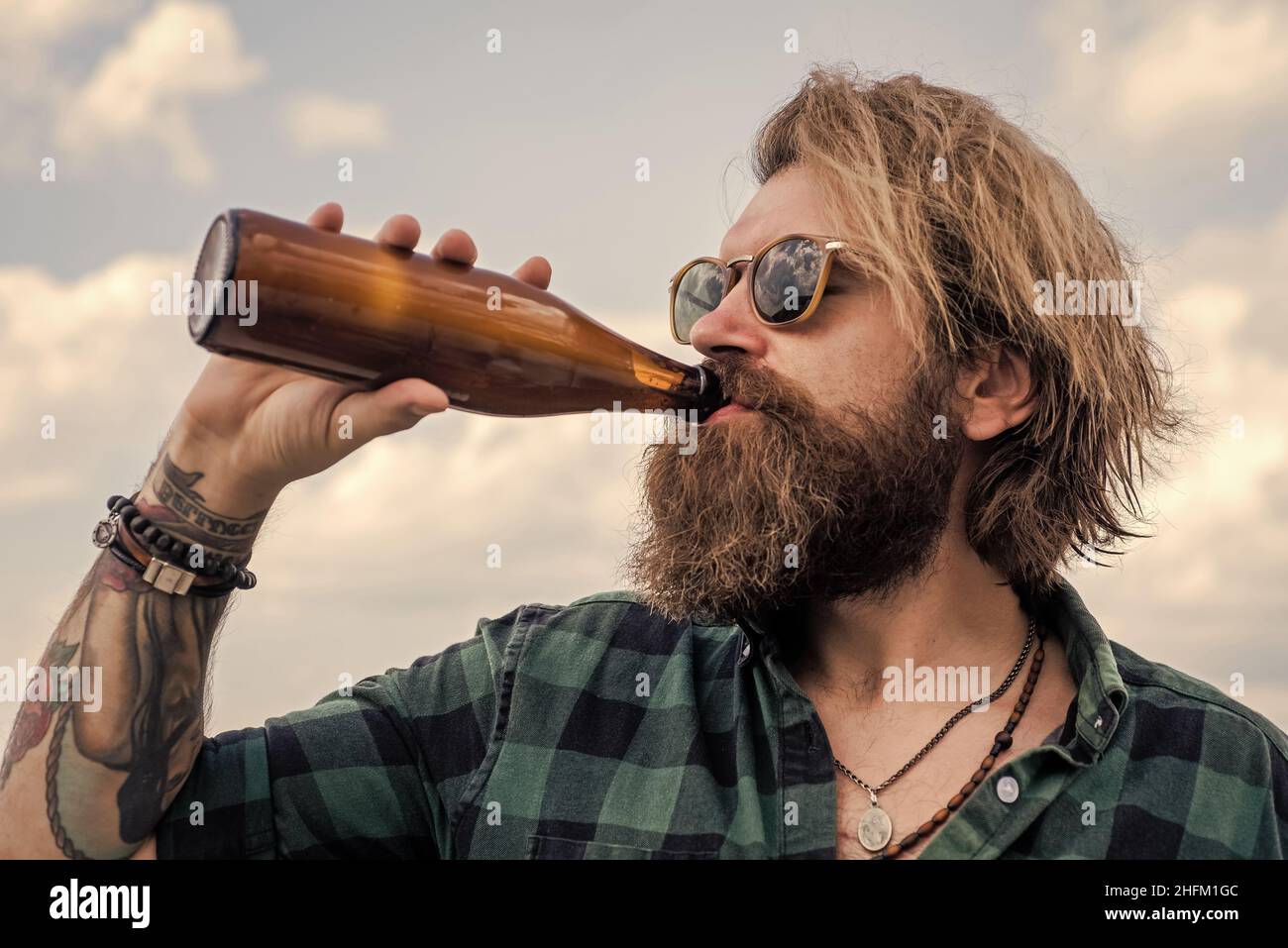 thirsty brutal handsome man with moustache drinking water. water ...