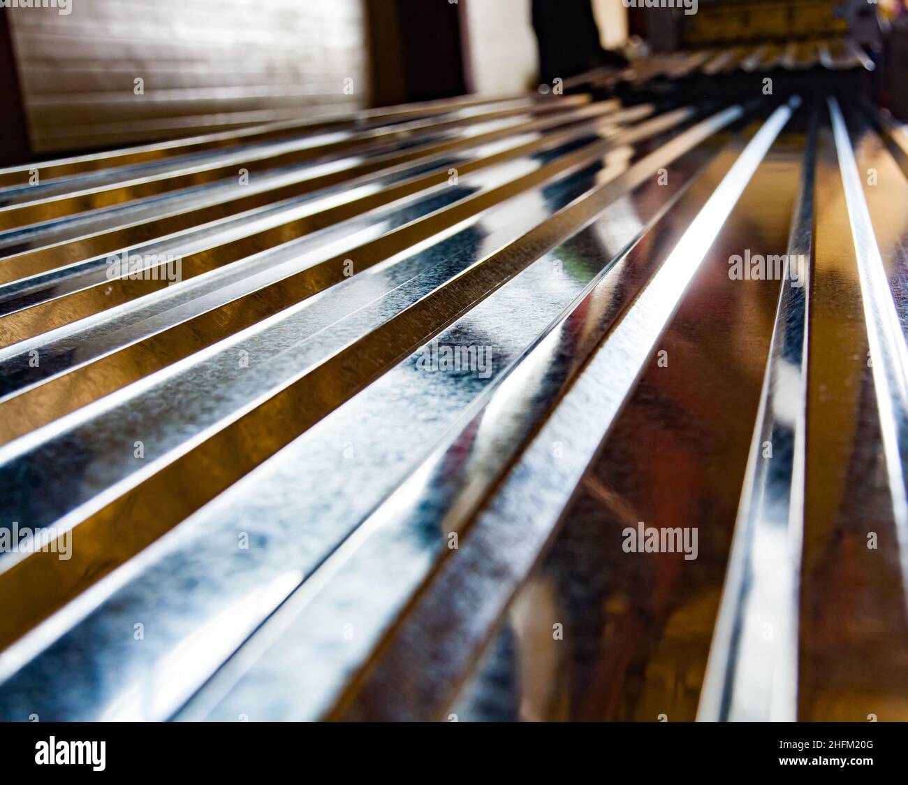 Metal profile production from galvanized steel sheet. Profile close-up ...
