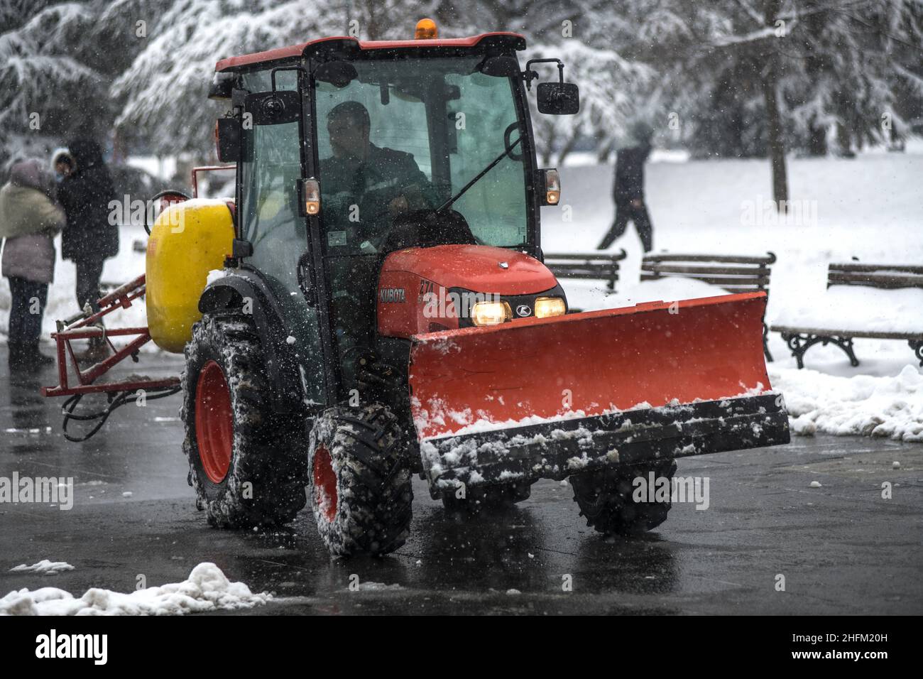 Snow plow truck cleaning the paths of Saint Sava Park, Belgrade, Serbia ...