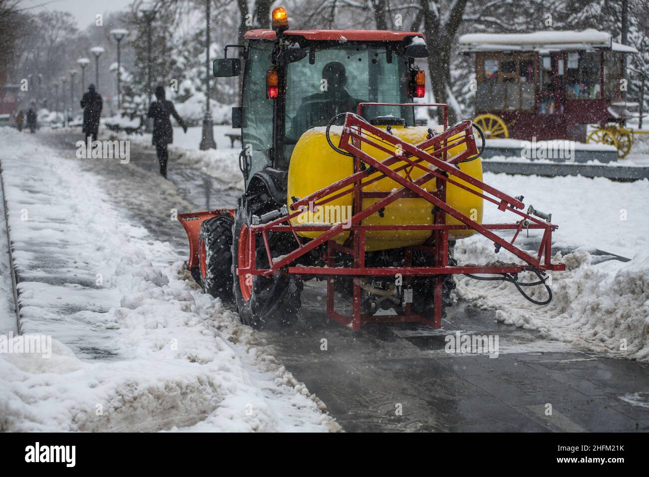 Snow plow truck cleaning the paths of Saint Sava Park, Belgrade, Serbia ...