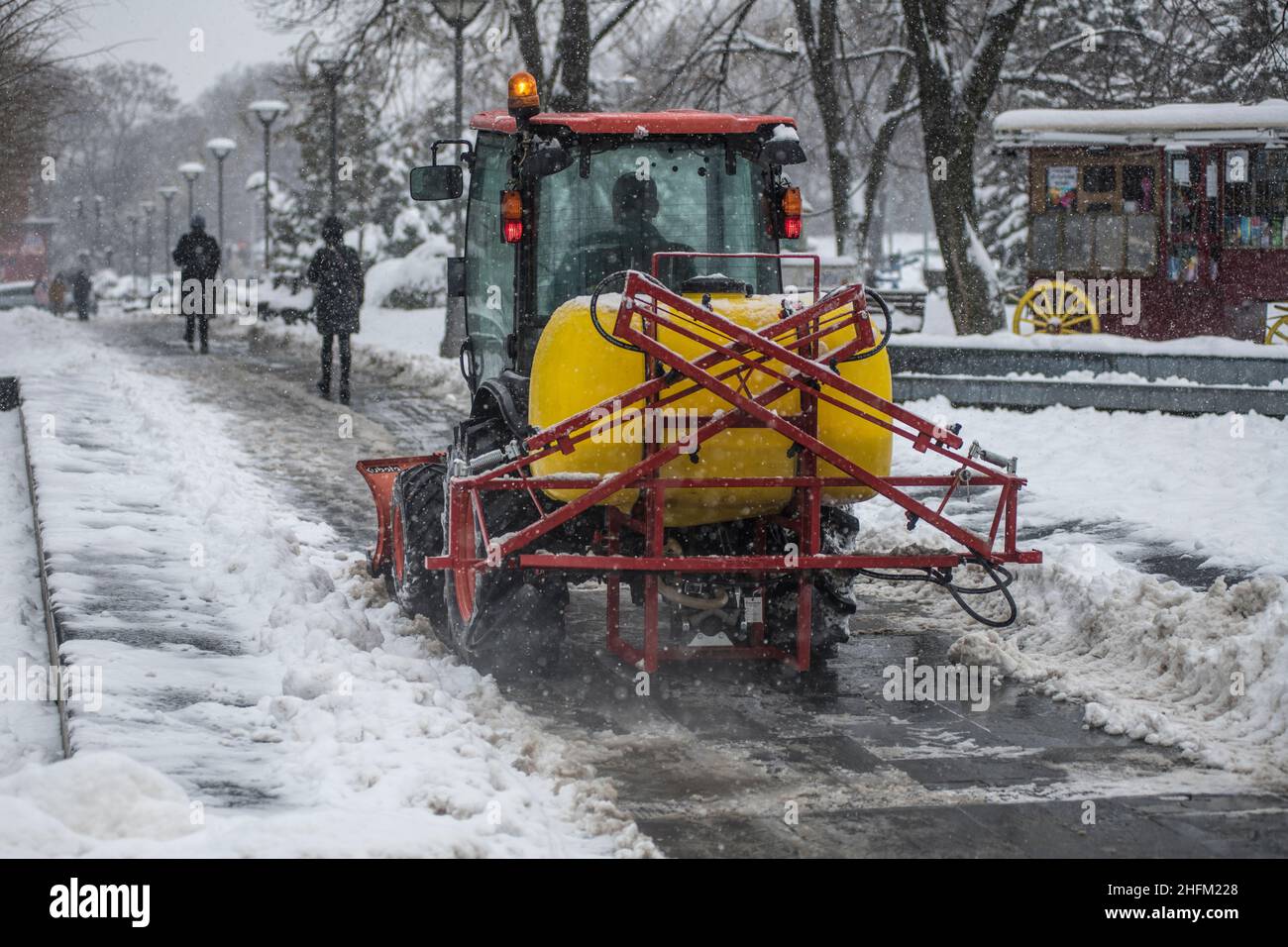 Snow plow truck cleaning the paths of Saint Sava Park, Belgrade, Serbia ...