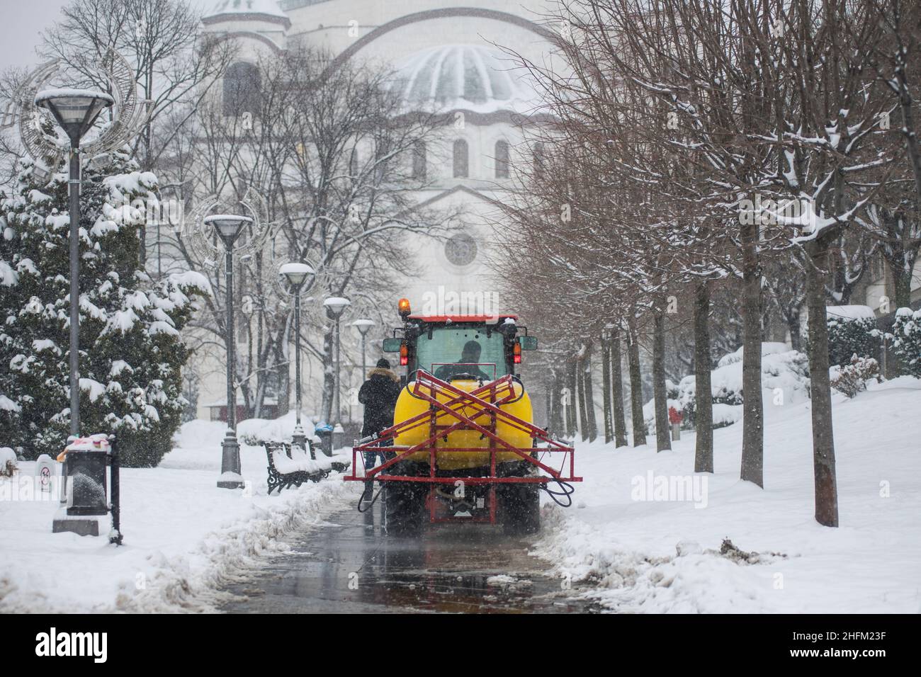 Snow plow truck cleaning the paths of Saint Sava Park, Belgrade, Serbia ...