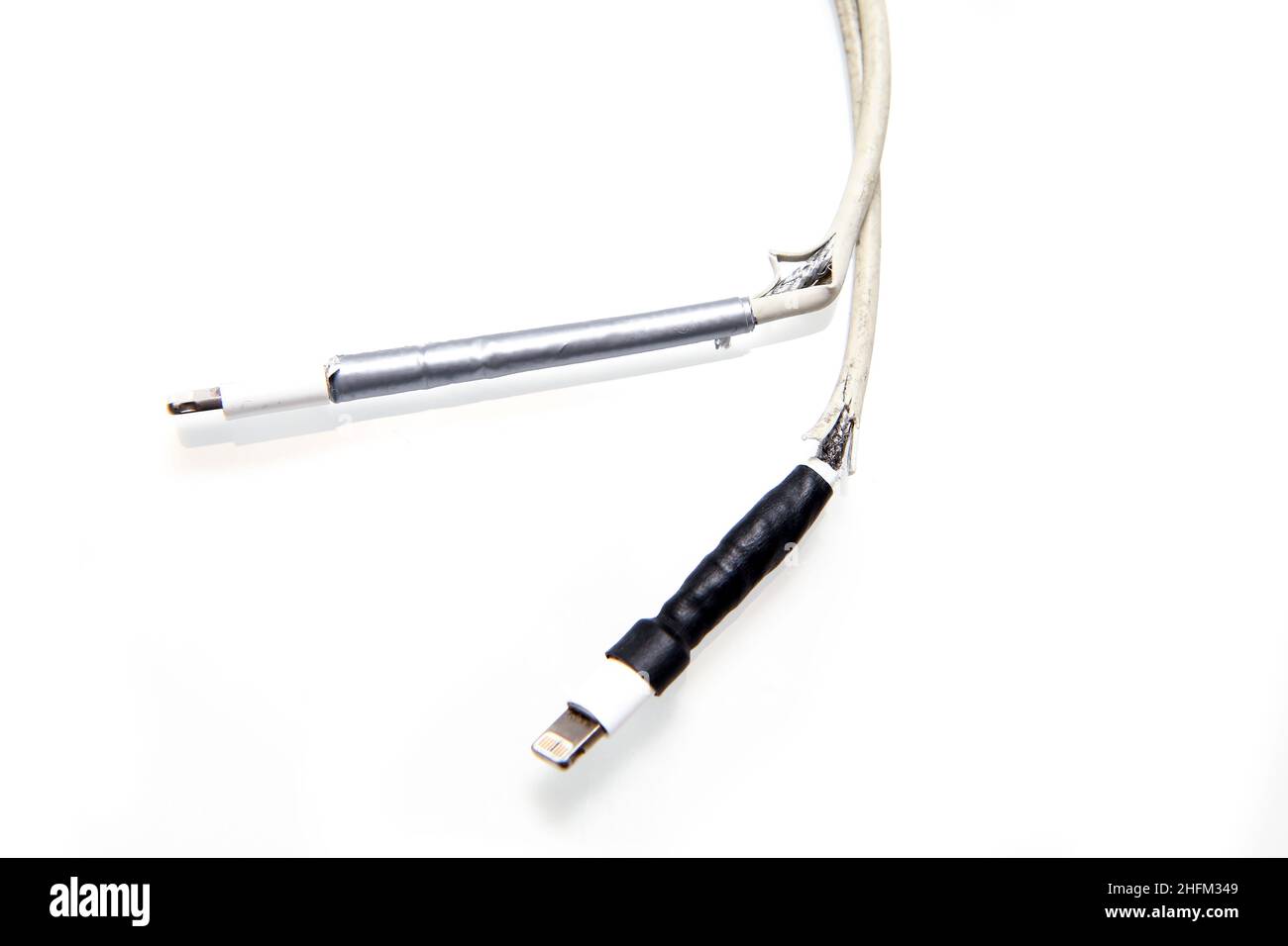 The detail of smart phones charger with broken and frayed cable ...