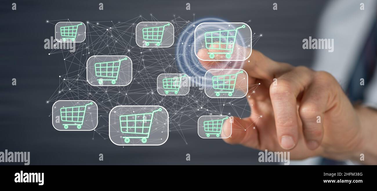 Man touching an online shopping concept on a touch screen with his ...