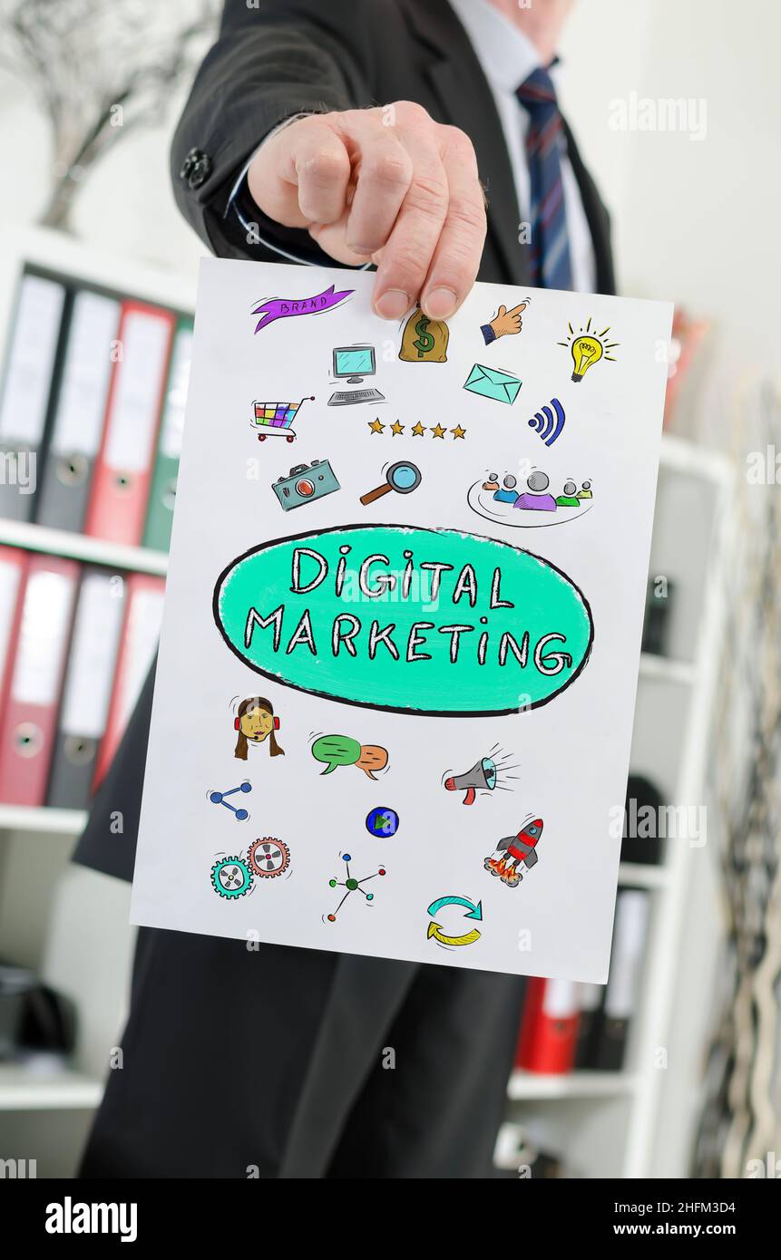Paper showing digital marketing concept held by a businessman Stock ...