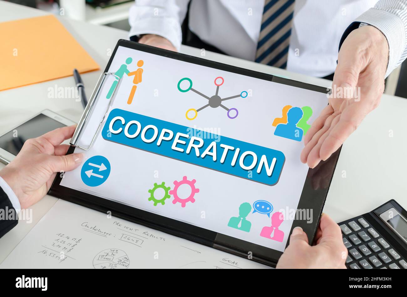 Cooperation concept shown by a businessman Stock Photo - Alamy