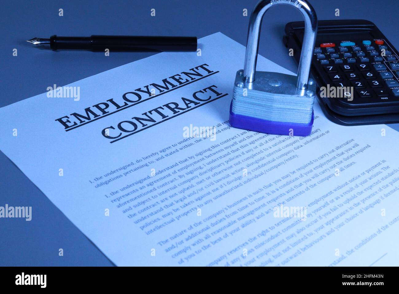 Employment contract with padlock, fountain pen and calculator Stock ...