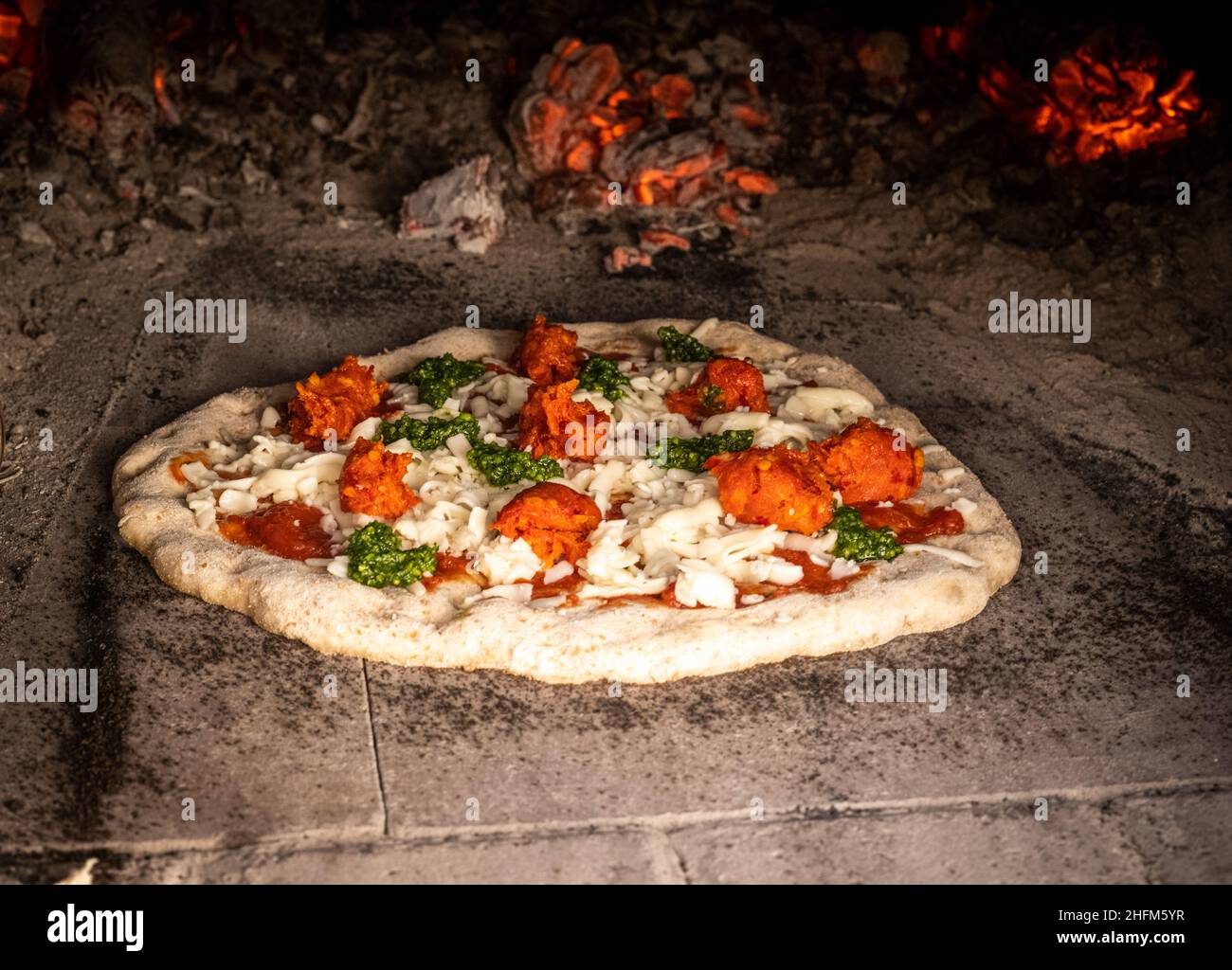 Wood fired rustic pizza in pizza oven Stock Photo - Alamy