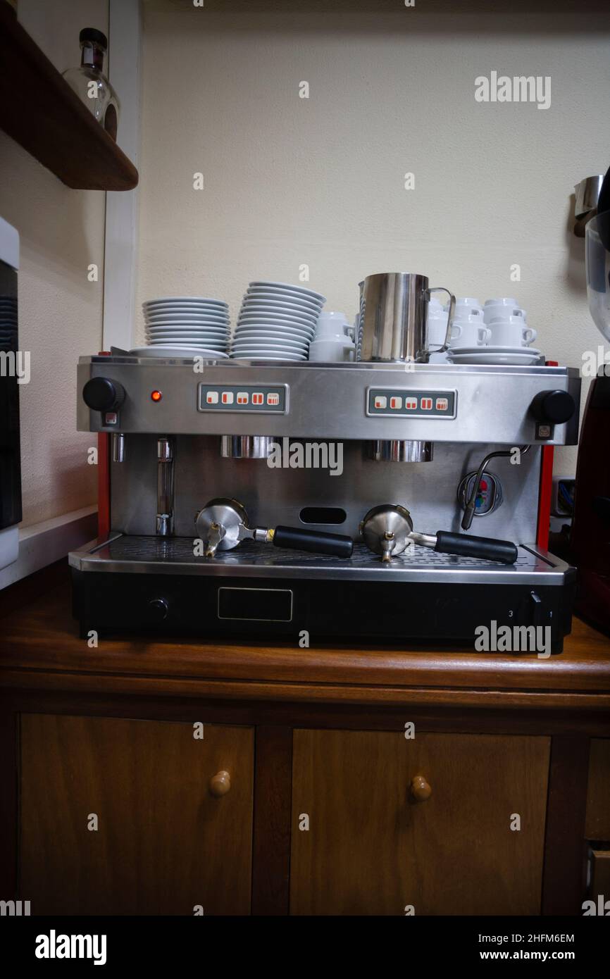 Professional coffee machine with cups and coffee trays Stock Photo - Alamy