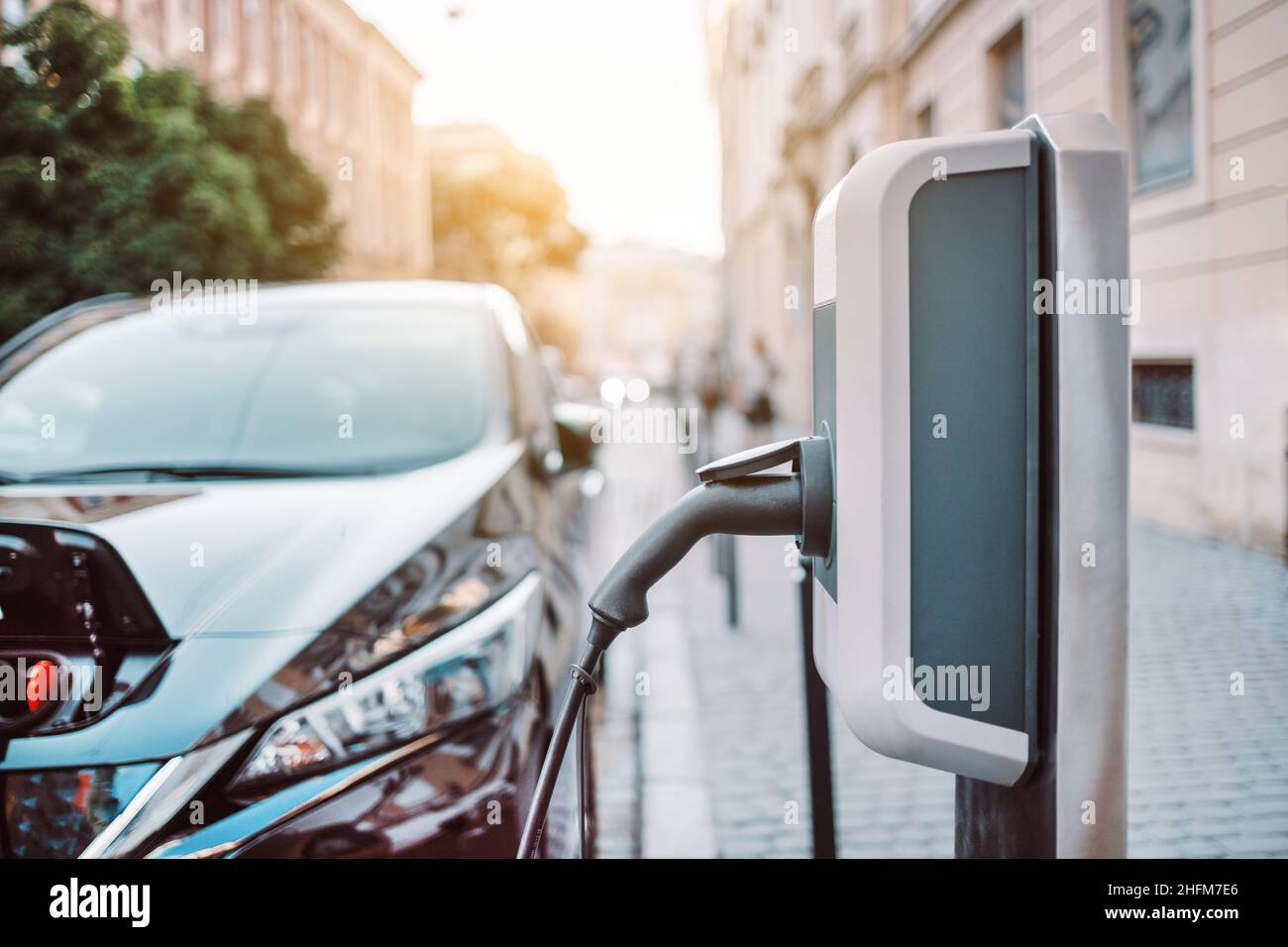 Charging modern electric car battery on the street Stock Photo - Alamy