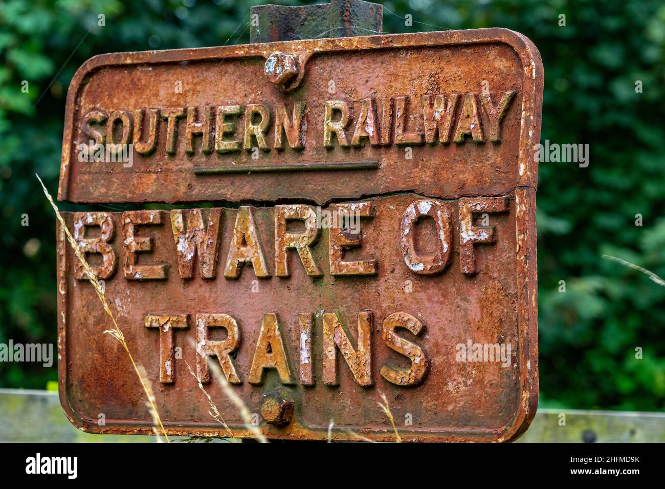 old beware of trains rust sign for southern railway. rusty and old ...