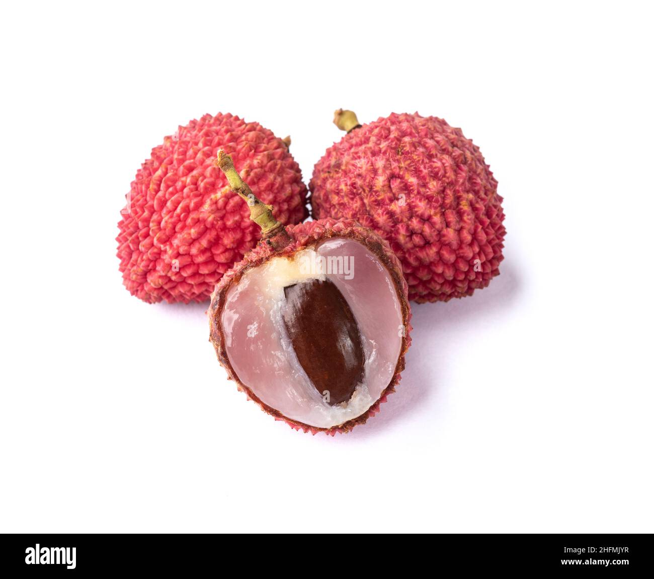 Lychees with cut fruit isolated over white background Stock Photo - Alamy