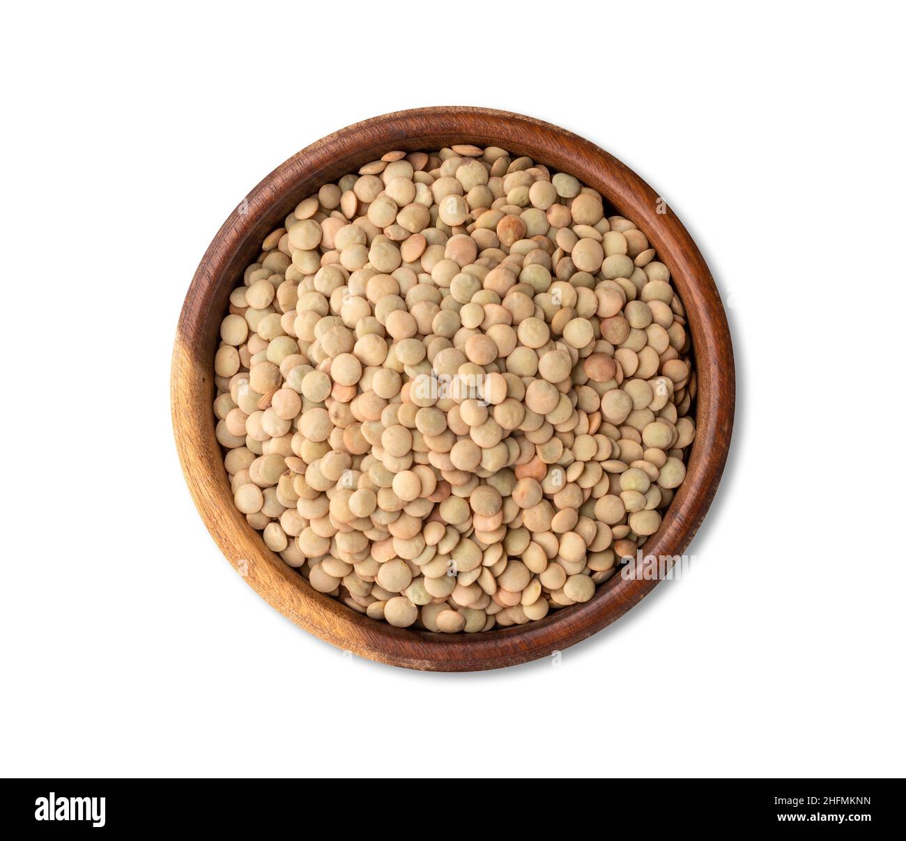 Raw lentils in a wooden bowl isolated over white background Stock Photo ...