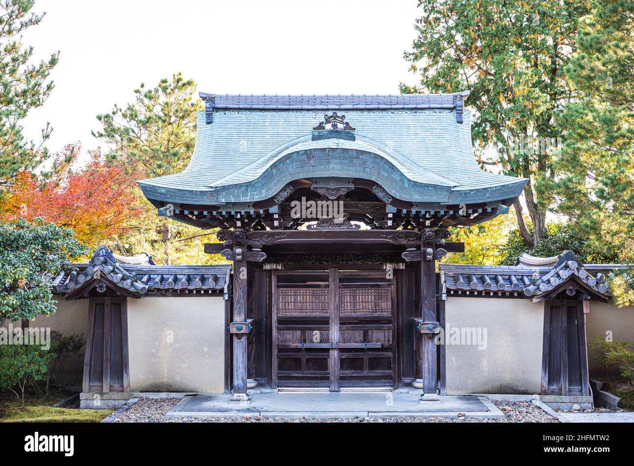 Traditional Japanese buildings with a hint of fall colors in soft light ...