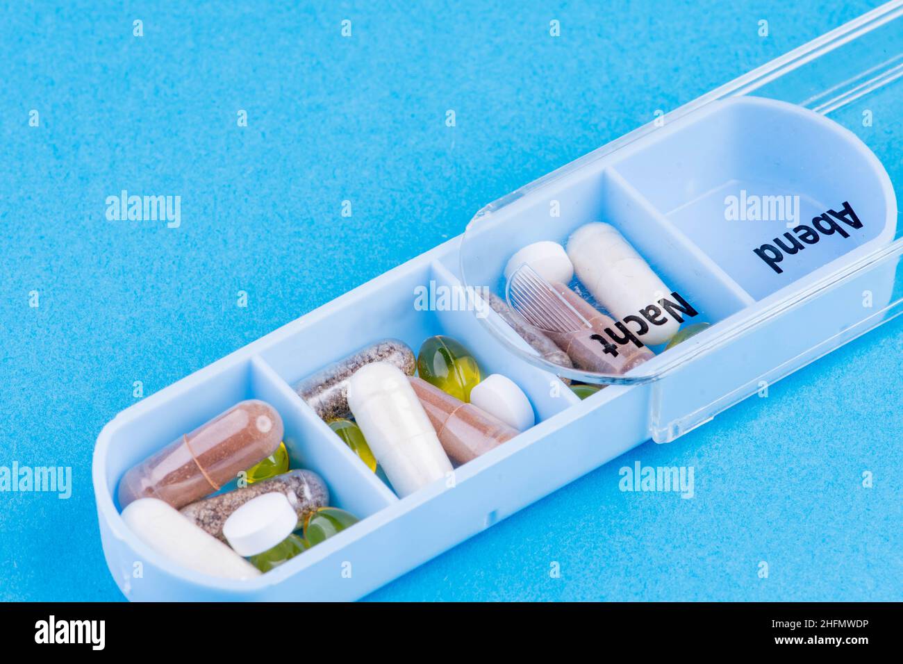 Tablet dosage box filled with nutritional supplements Stock Photo - Alamy