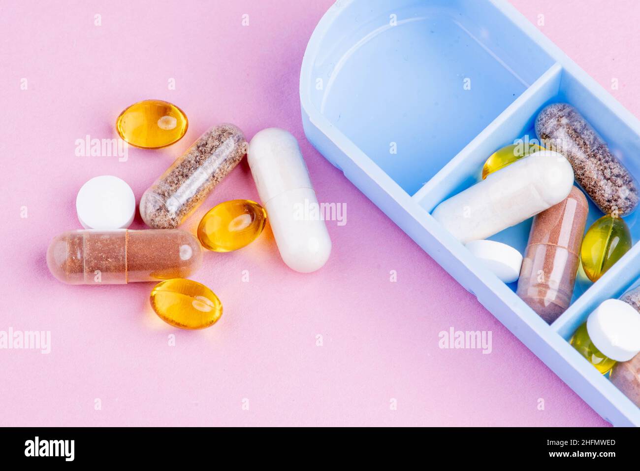 Tablet dosage box filled with nutritional supplements with text space ...