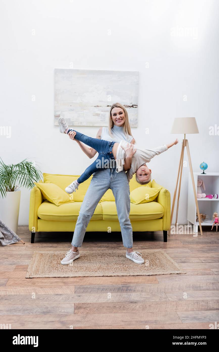 Happy family lifting child hi-res stock photography and images - Alamy