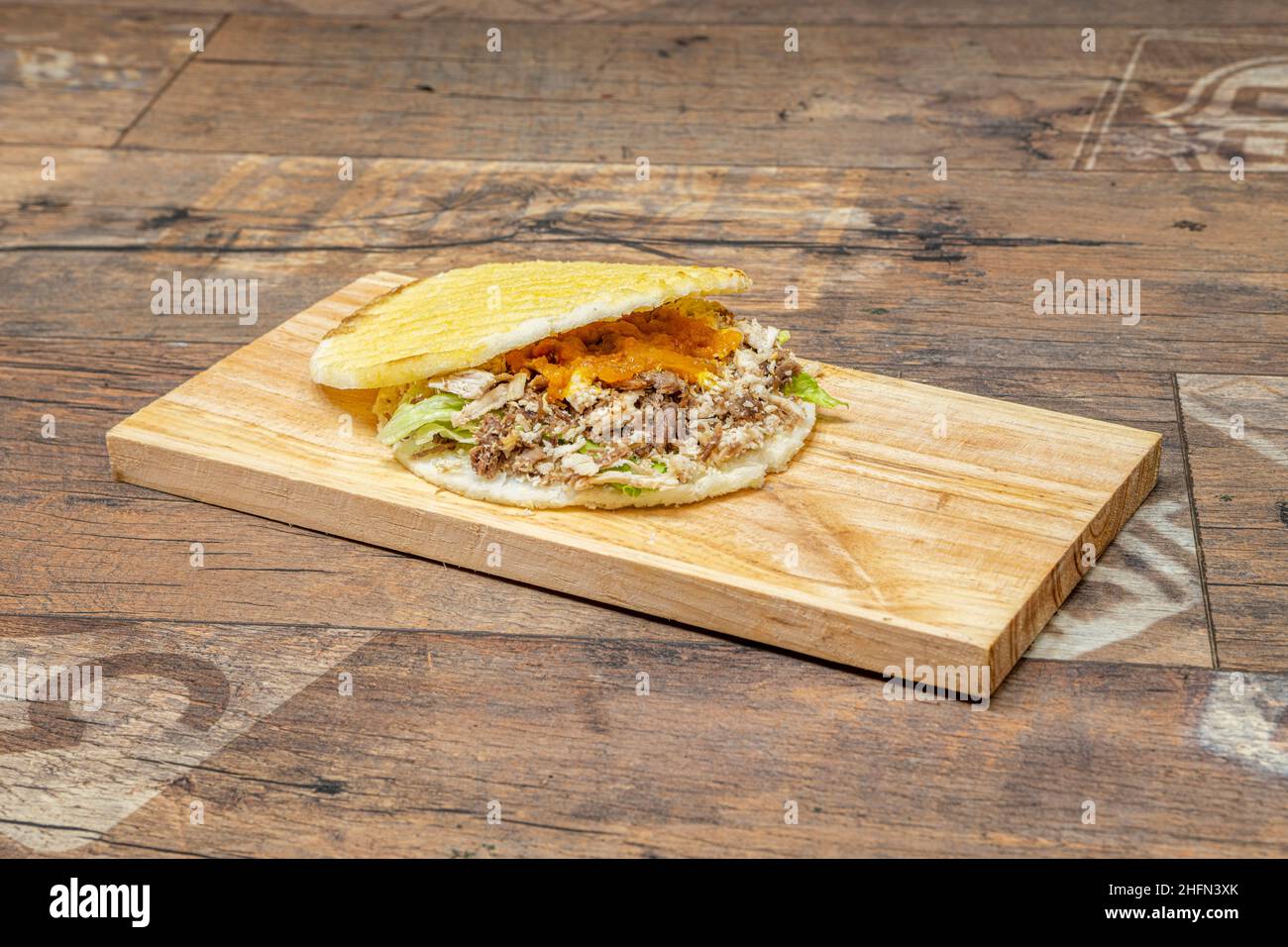 The arepa is a food of pre-Columbian origin, made from ground dry corn ...