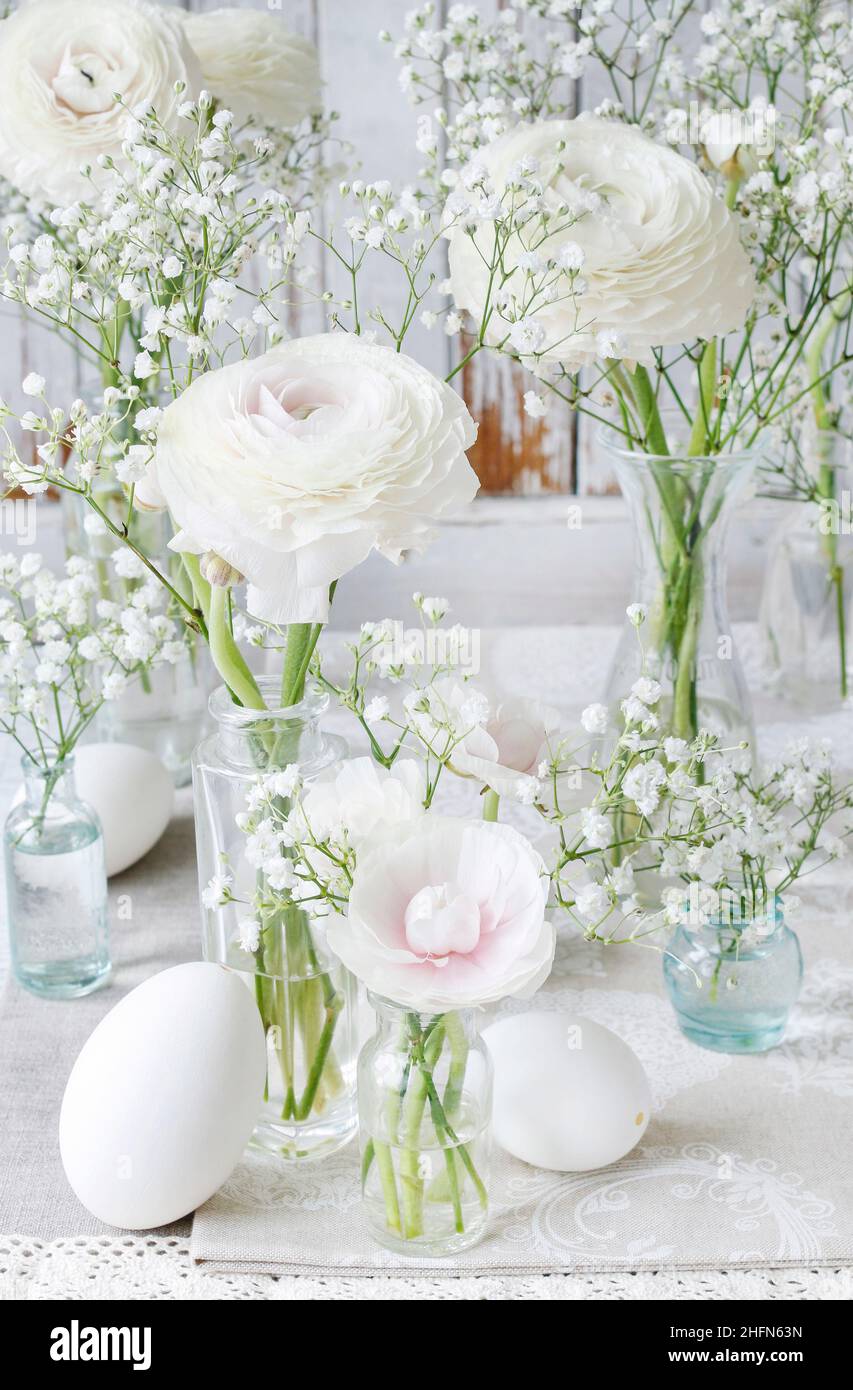 Floral arrangement with ranunculus flowers and white gypsophila ...
