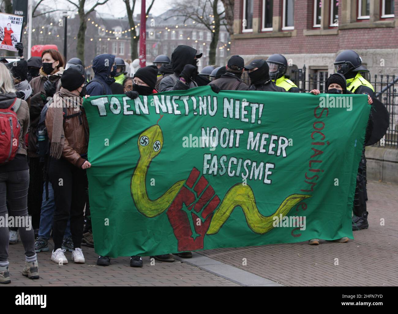 Dutch anti-riot police escort Anti-Facist activist to avoid ...