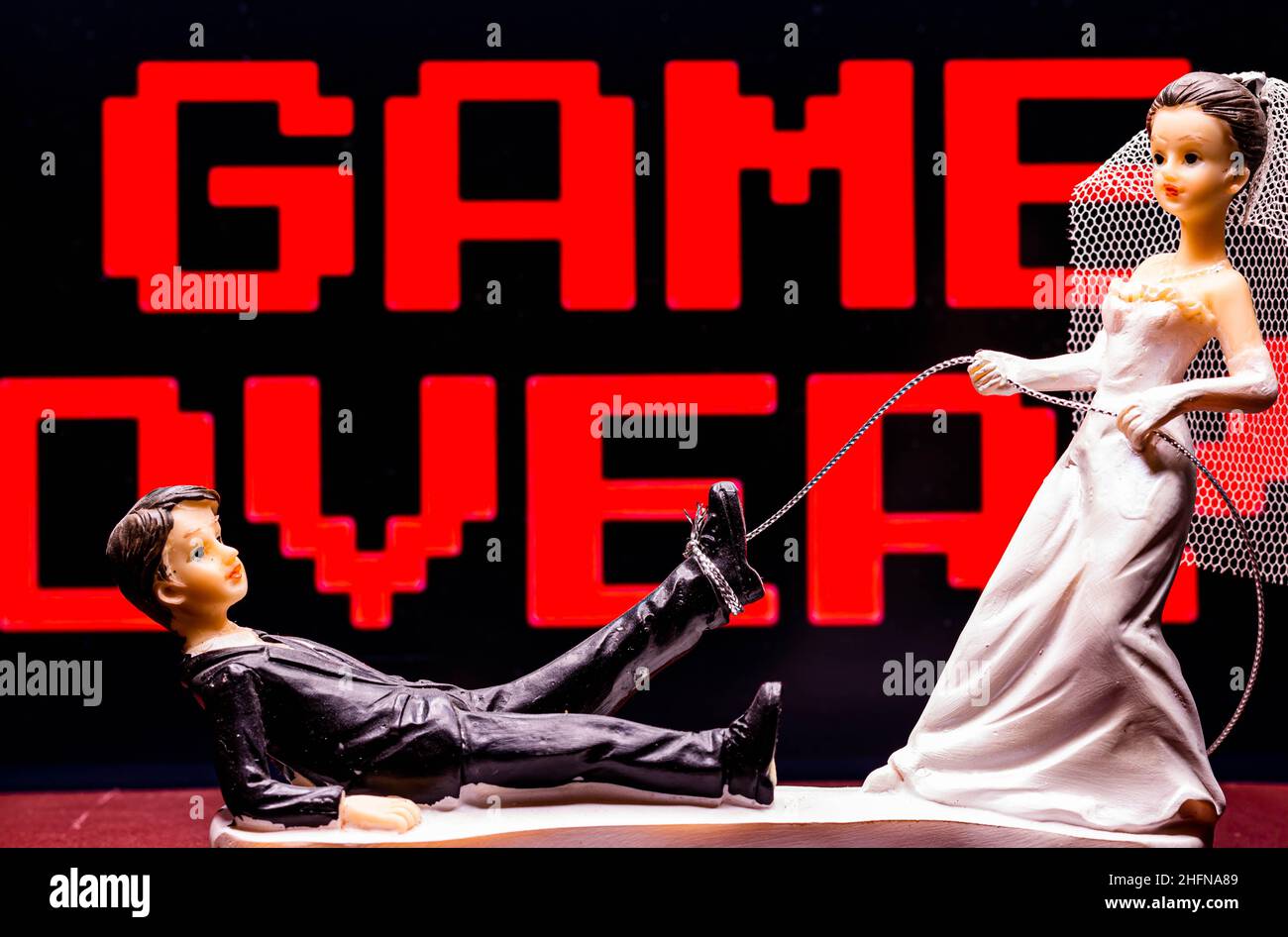 a woman draws a man to the wedding - Game over Stock Photo - Alamy