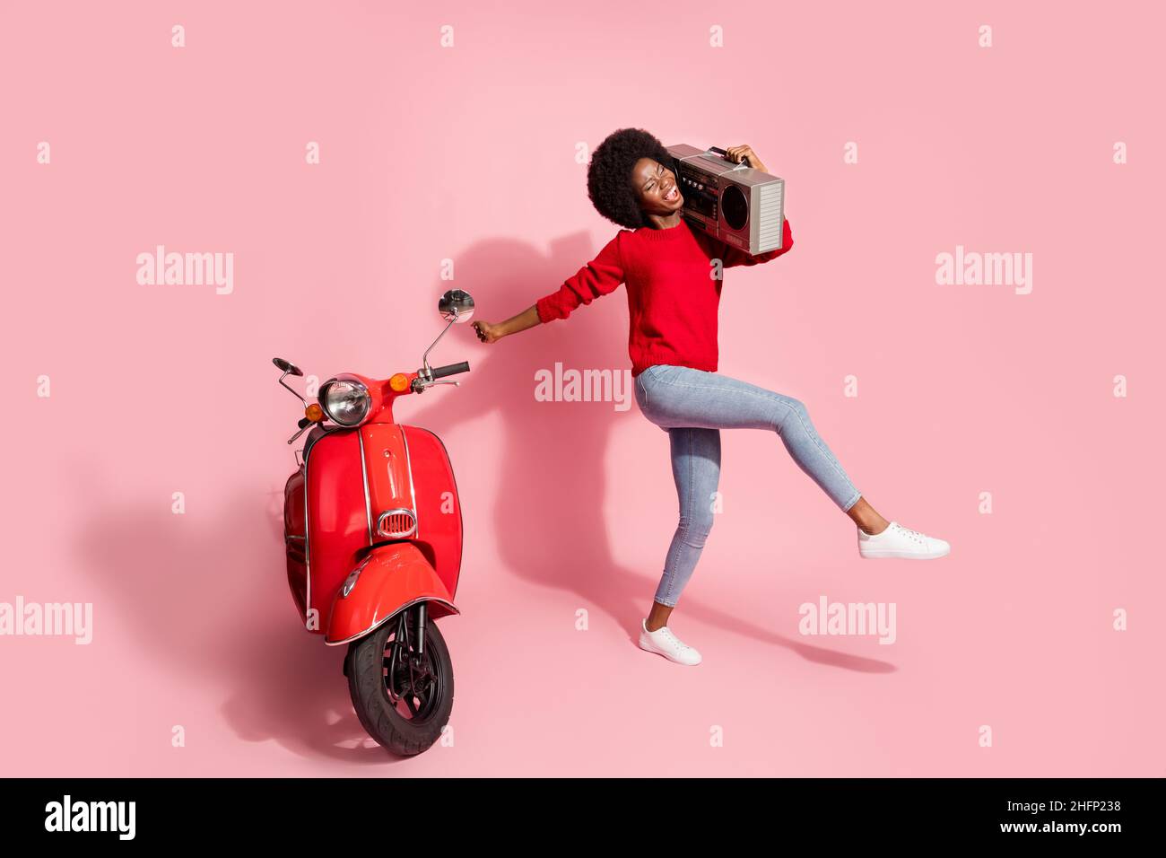 Full length body size view of attractive cheerful girl carrying player ...