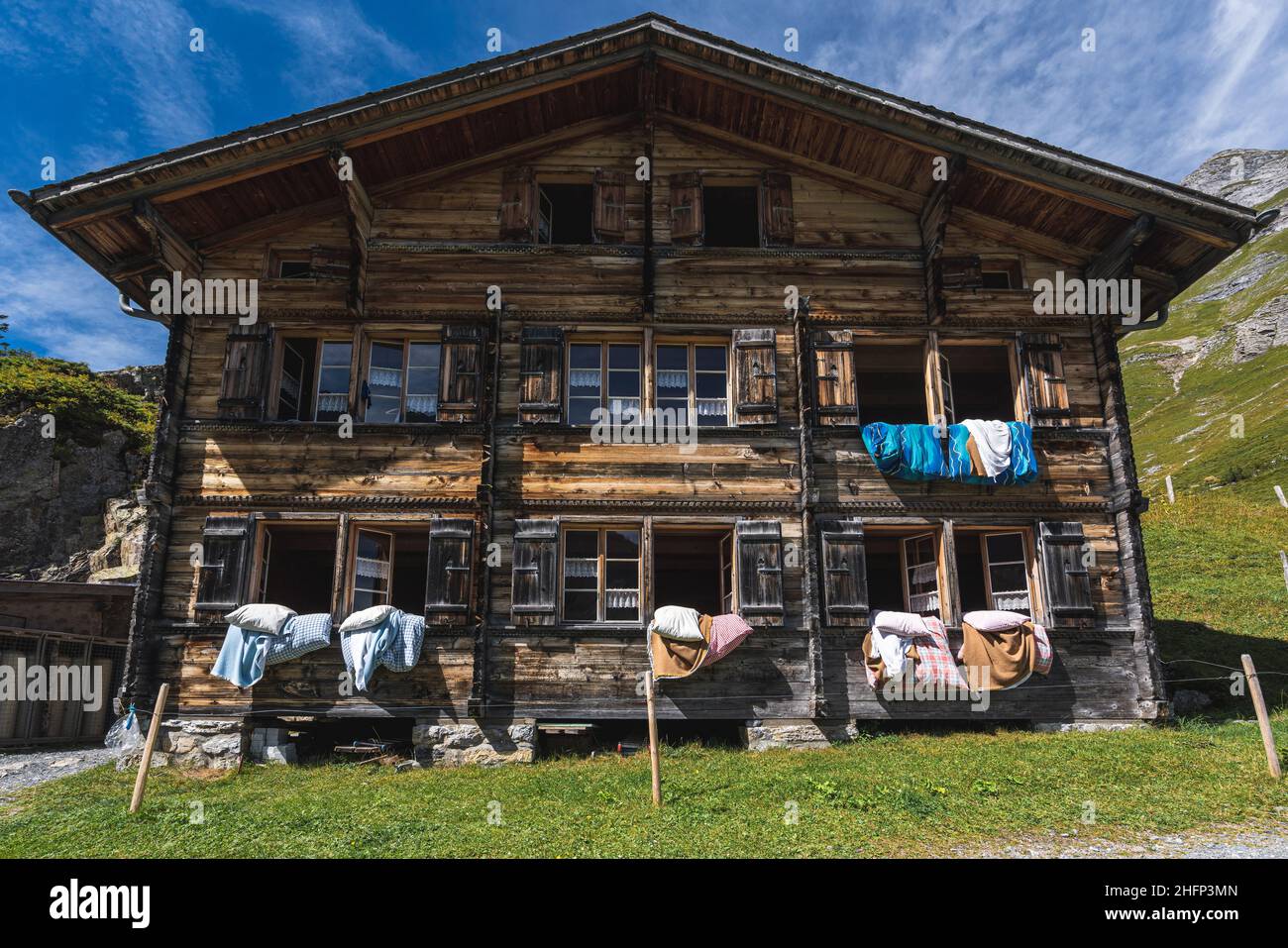 A rustic and idyllic mountain hut with a blue sky in the Lauterbrunnen ...