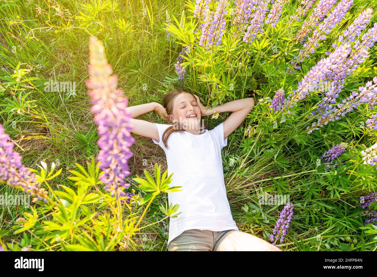 Happy teenage girl smiling outdoor. Beautiful young teen woman resting ...