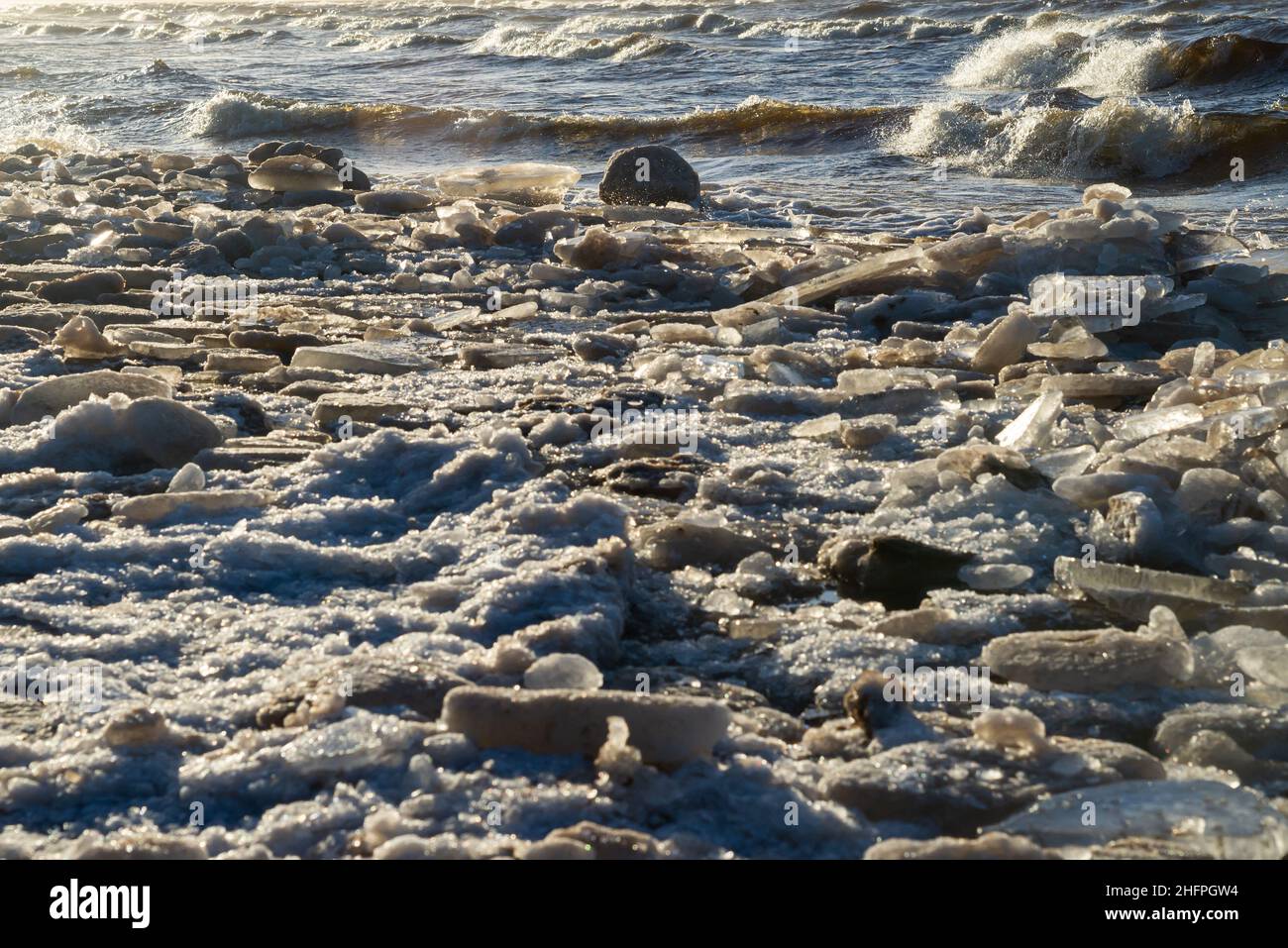 frozen sea side beach panorama in winter with lots of ice and snow in ...