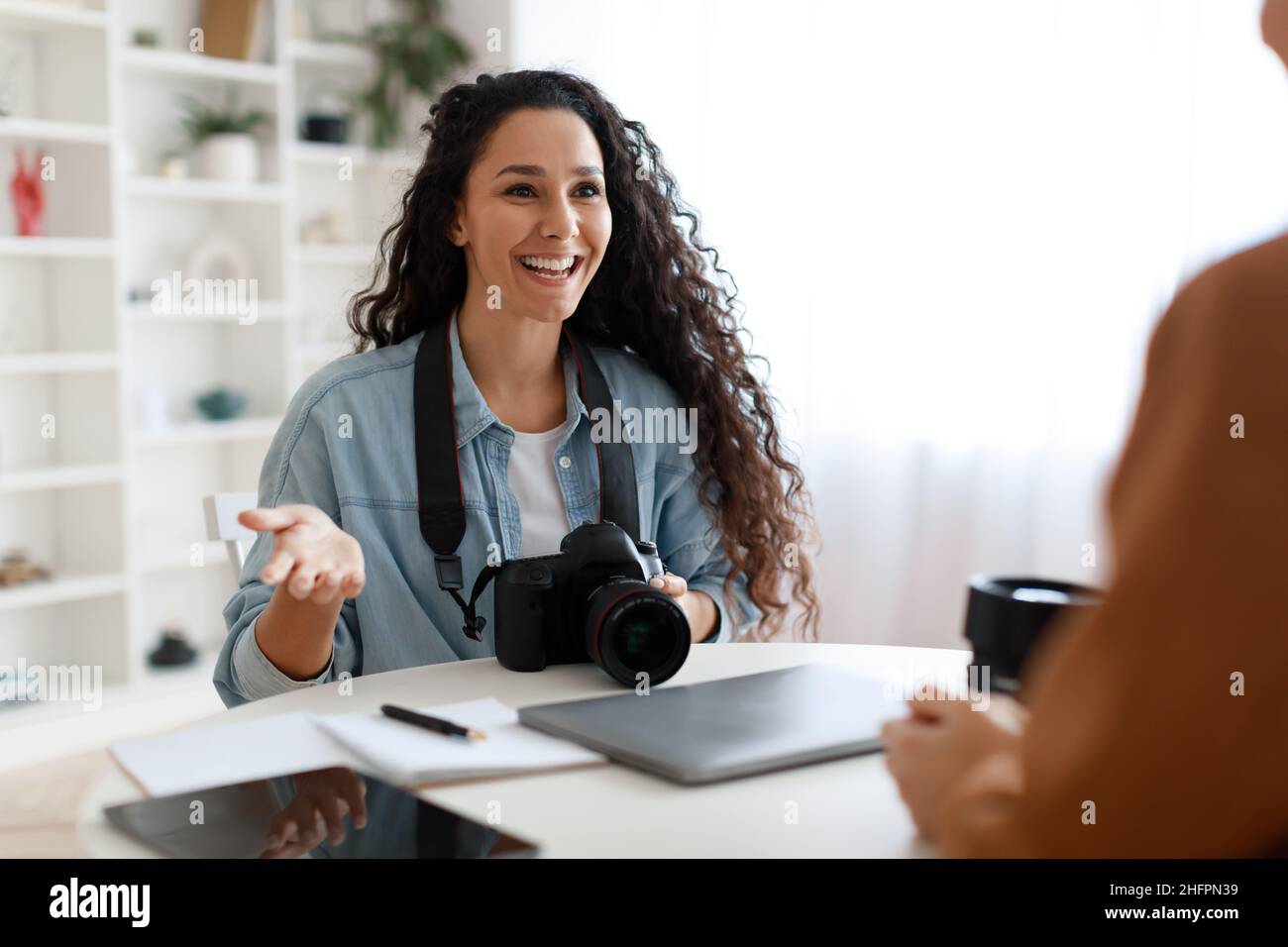 Female Photographer Having Job Interview Talking To Lady In Office ...