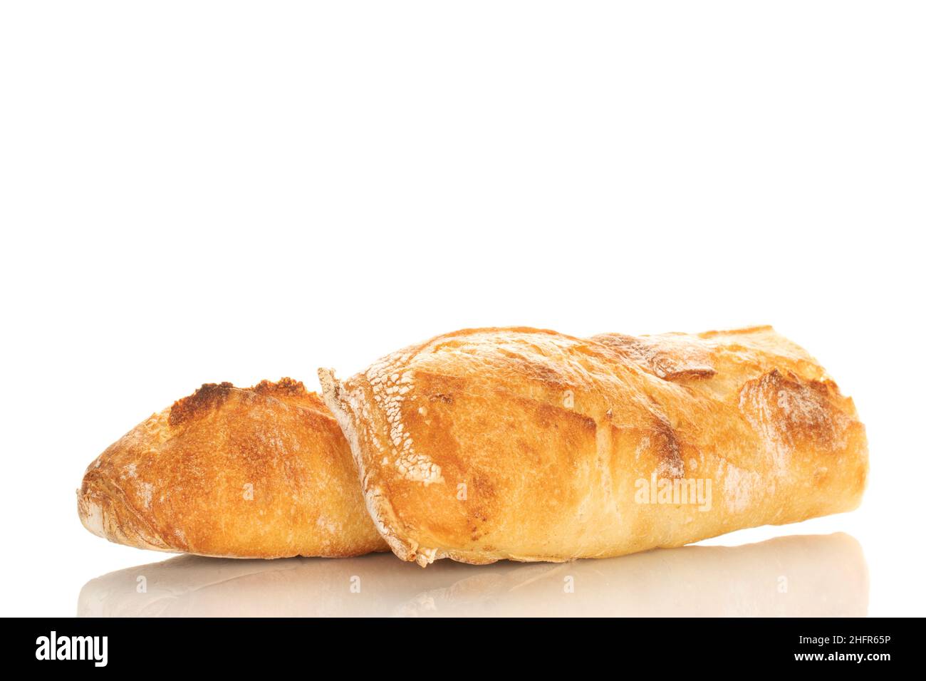 One freshly baked French baguette, close-up, isolated on white Stock ...