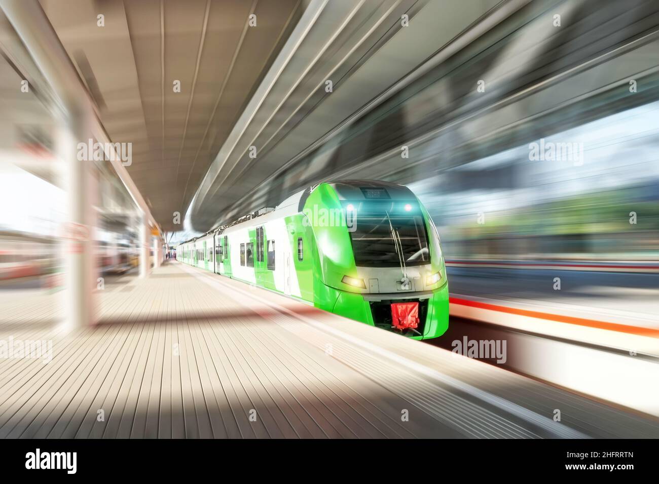 High speed train in motion on the railway station. Modern intercity ...