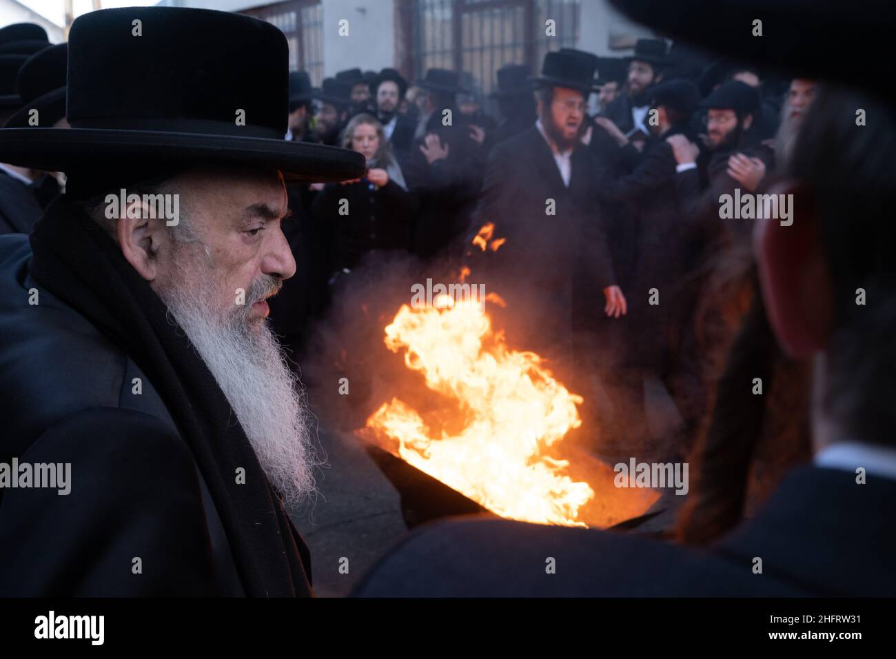 Ultra orthodox Jews (hassids) are seen dancing around the fire in front ...