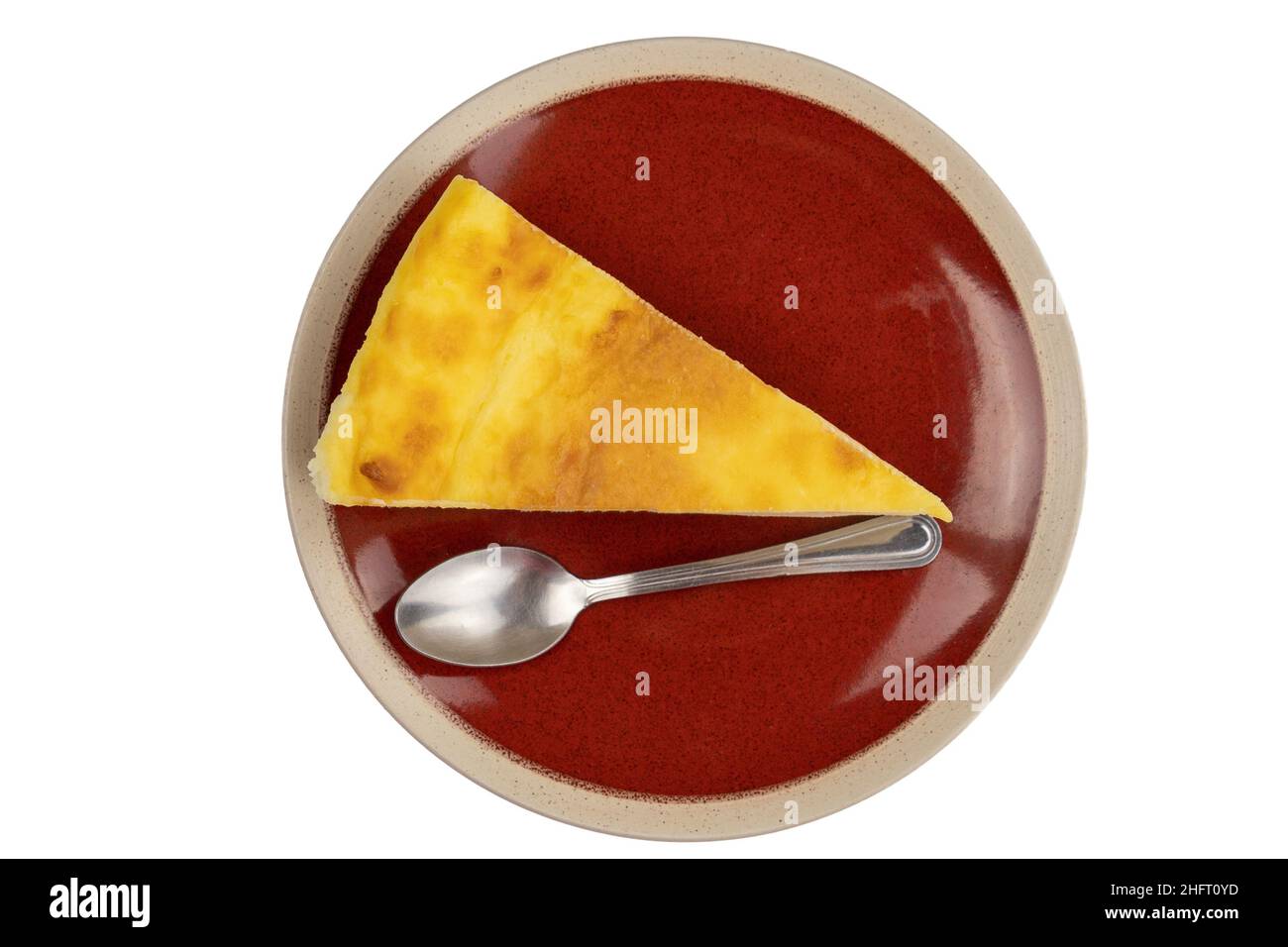 slice of flan in a plate on a white background Stock Photo - Alamy