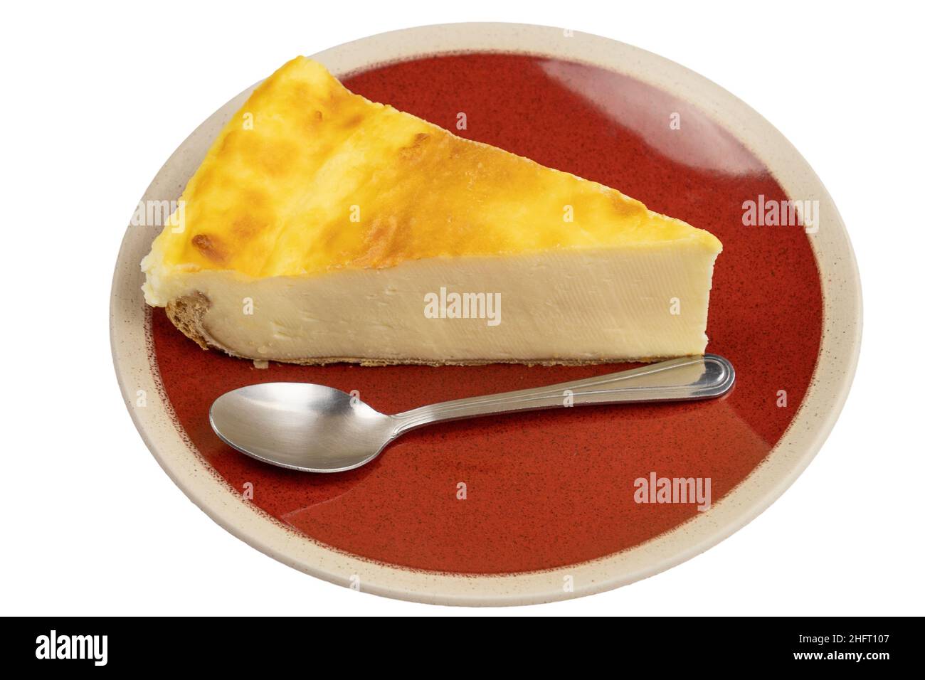 slice of flan in a plate on a white background Stock Photo - Alamy