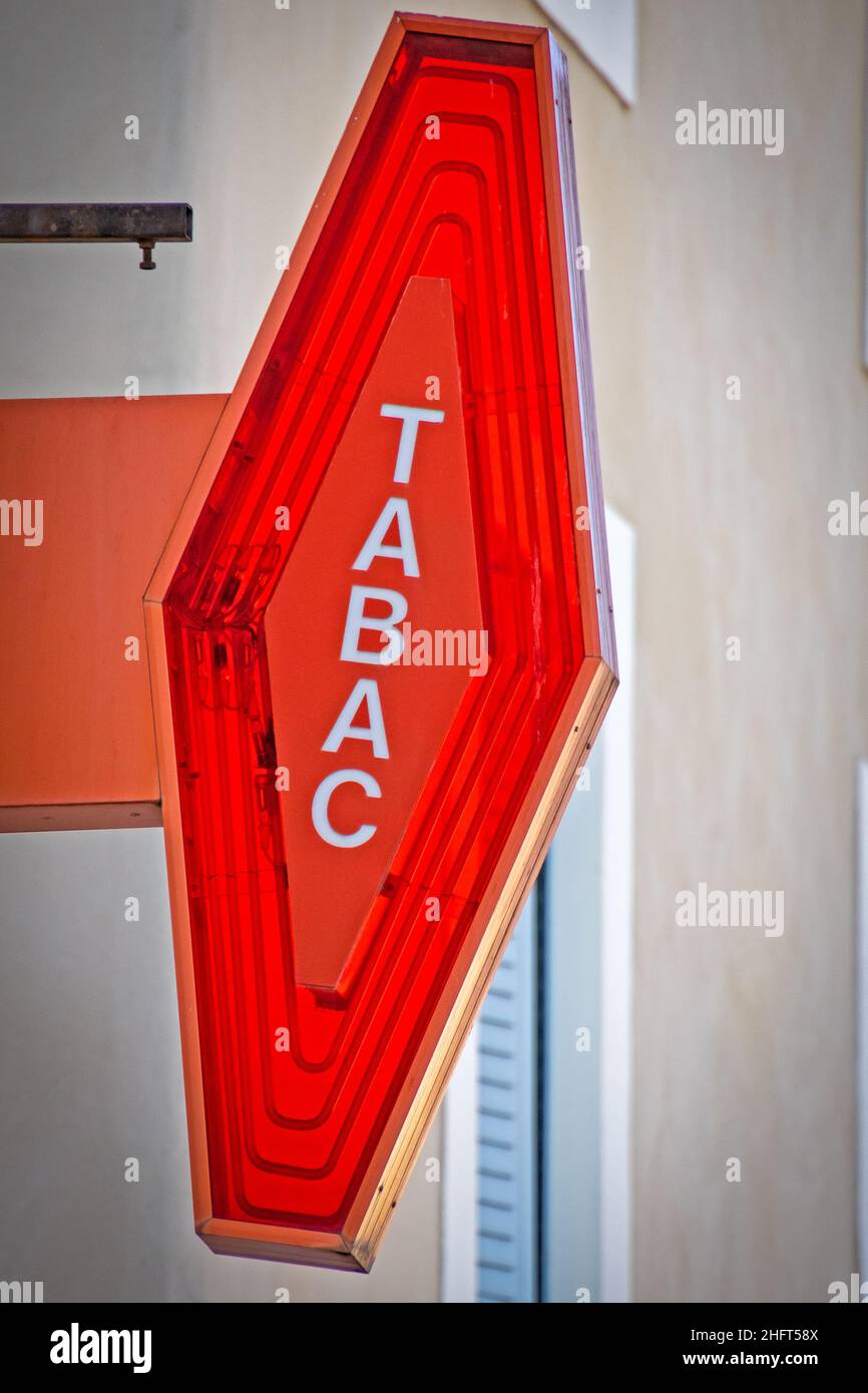 tobacco sign on a red background outdoors Stock Photo - Alamy