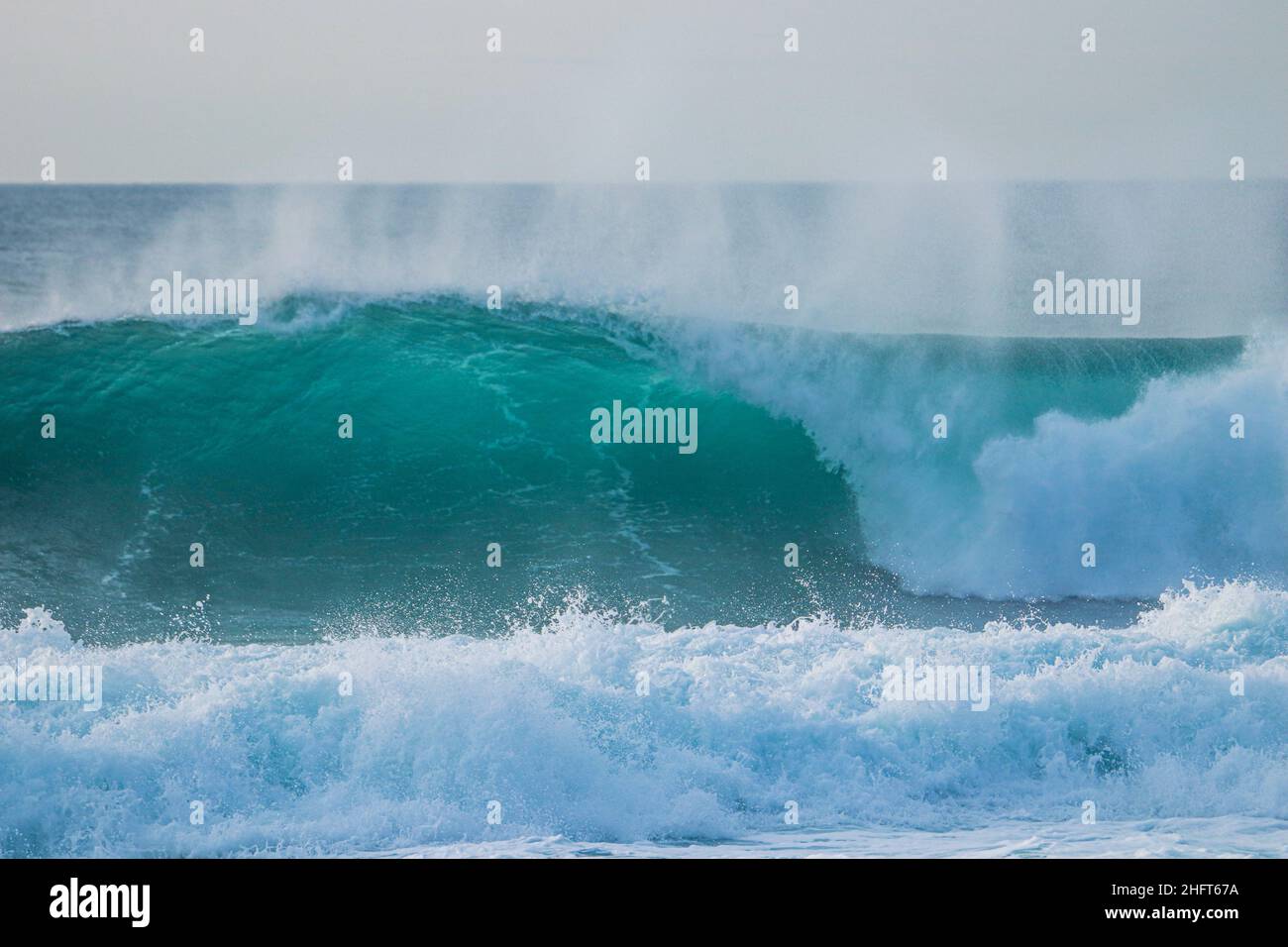 Perfect wave breaking in a beach. Surf spot Stock Photo - Alamy