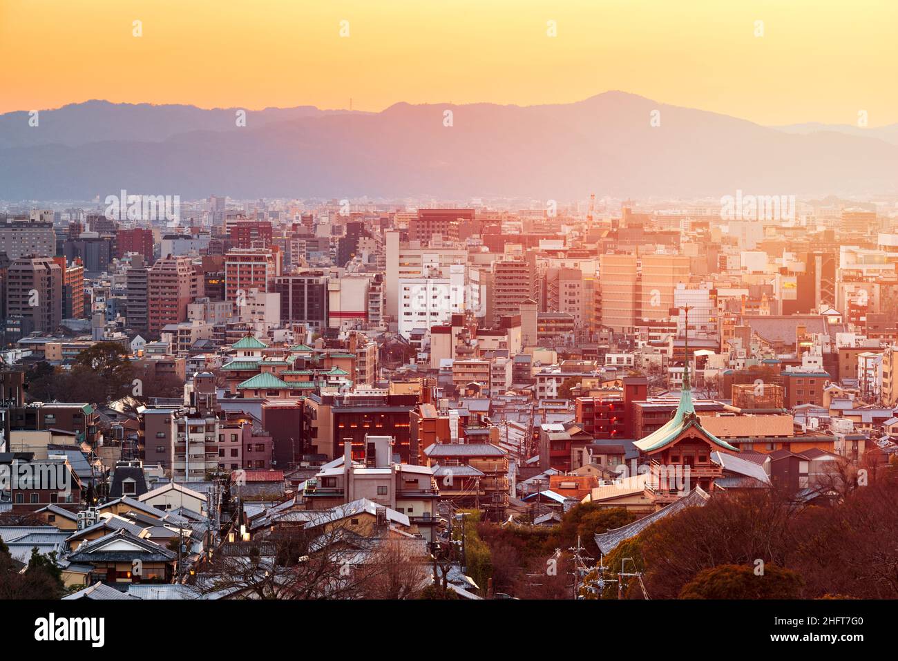 Kyoto, Japan downtown cityscape with new and old architecture at dusk ...