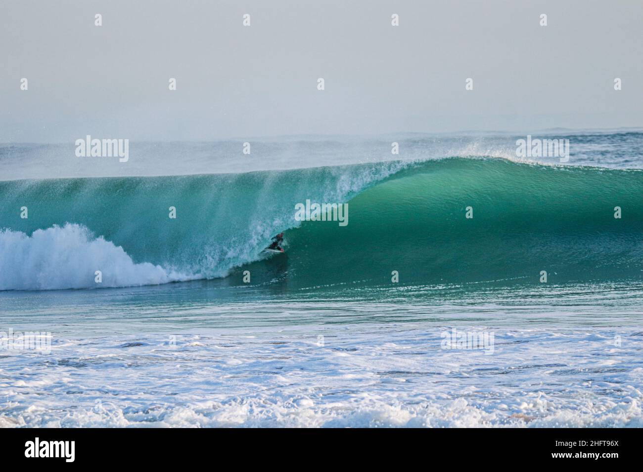 Surfer in a perfect barrel wave Stock Photo - Alamy