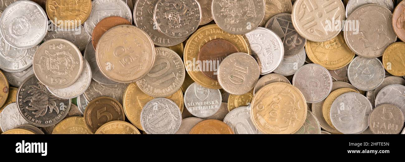 Banner with coins as background. Various vintage coins from worldwide ...
