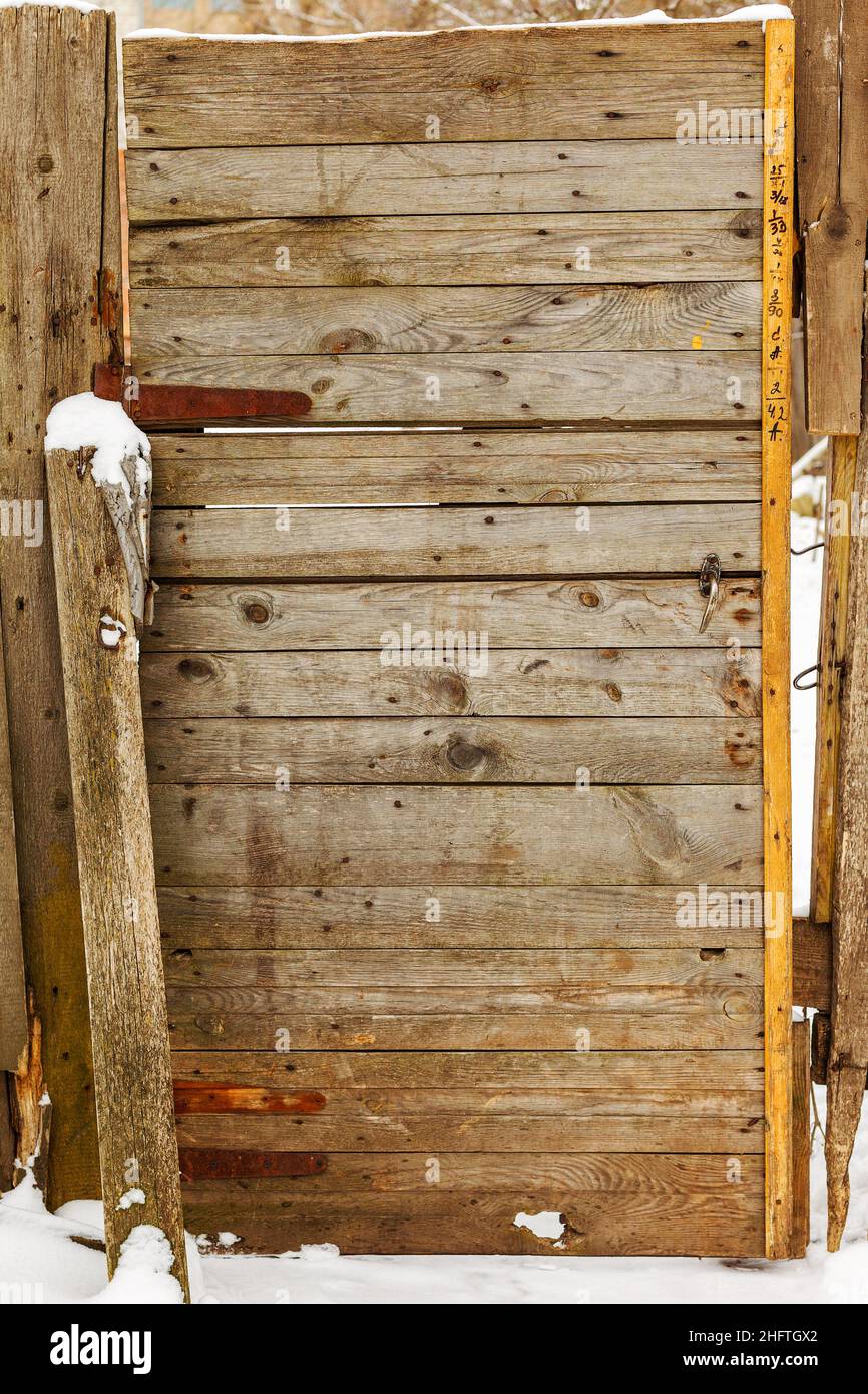 Old rustic wooden door covered with snow Stock Photo - Alamy