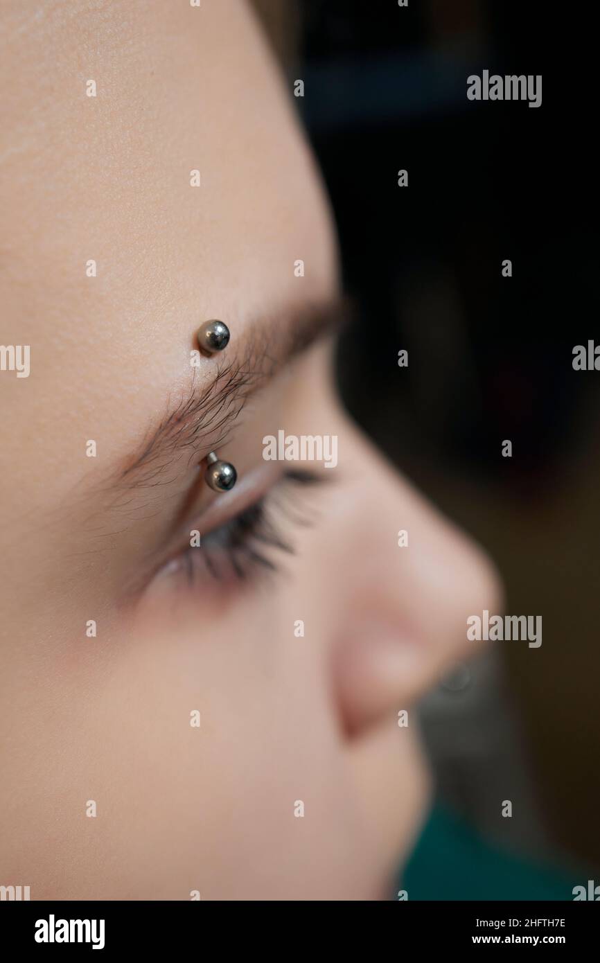 smile or frenulum piercing under the upper lip Stock Photo - Alamy