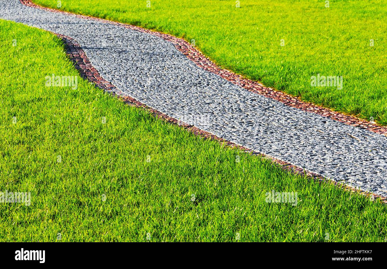 Textured background stone pathway in green park Stock Photo - Alamy
