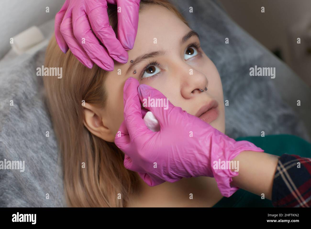 smile or frenulum piercing under the upper lip Stock Photo - Alamy