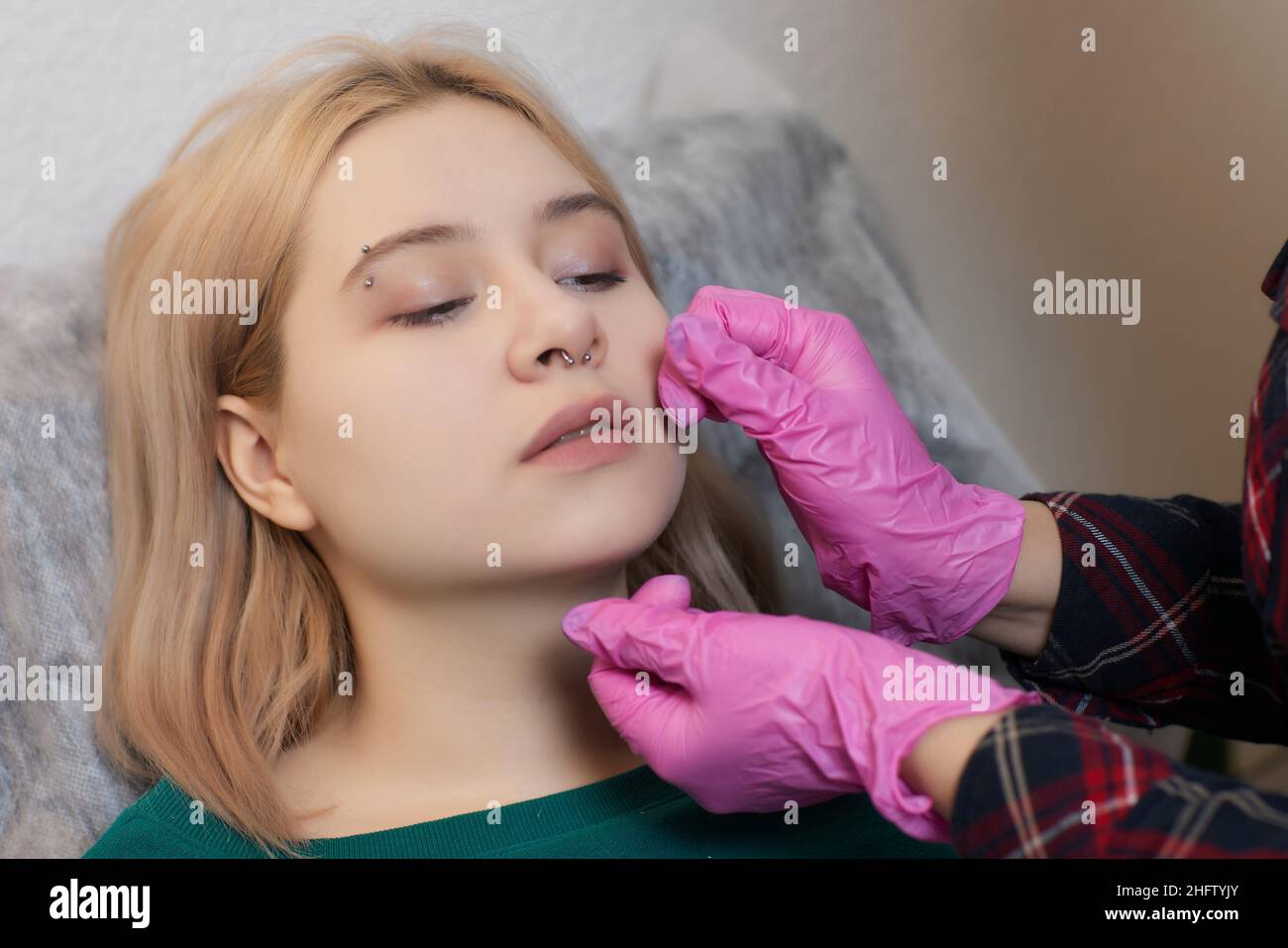 smile or frenulum piercing under the upper lip Stock Photo - Alamy