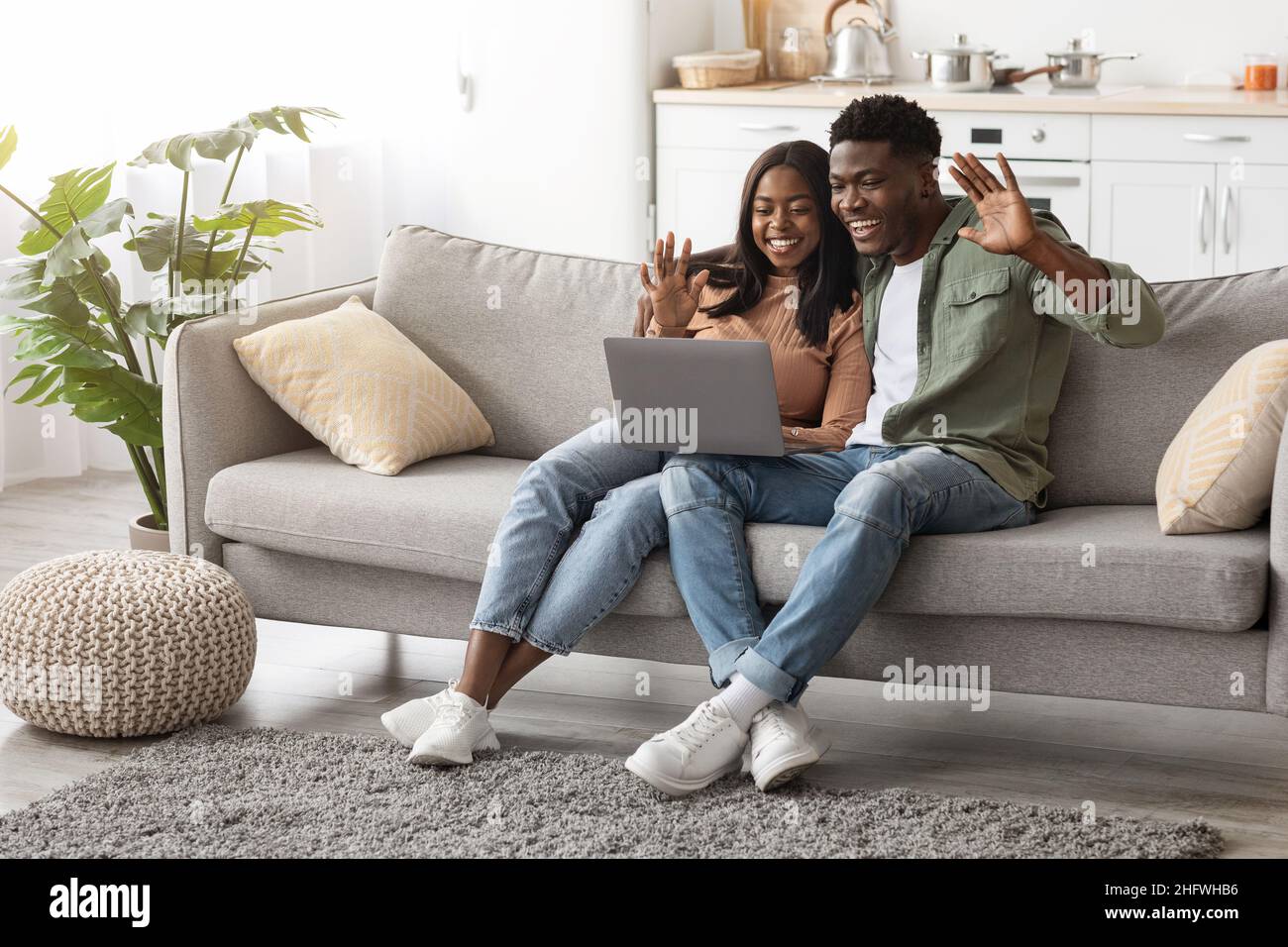 Happy african american family using computer at home Stock Photo - Alamy