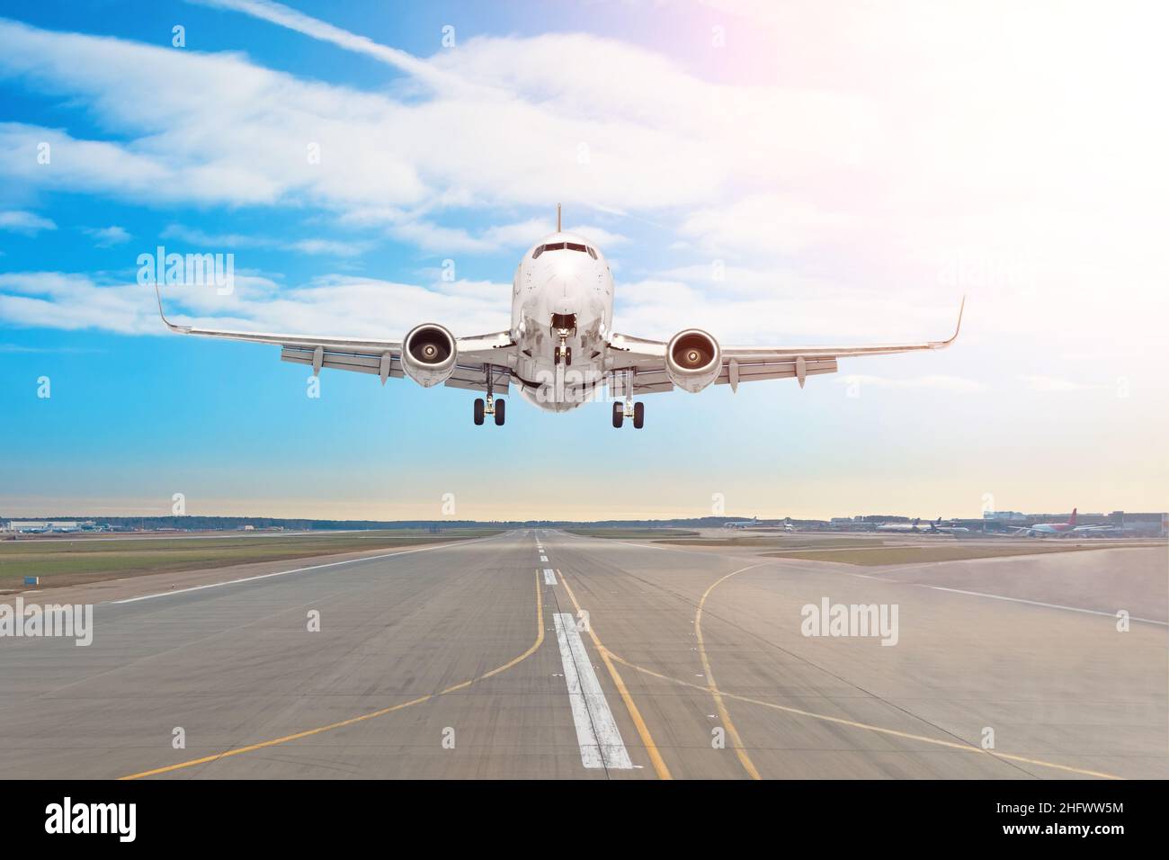 Passenger aircraft with on the asphalt landing on a runway airport ...